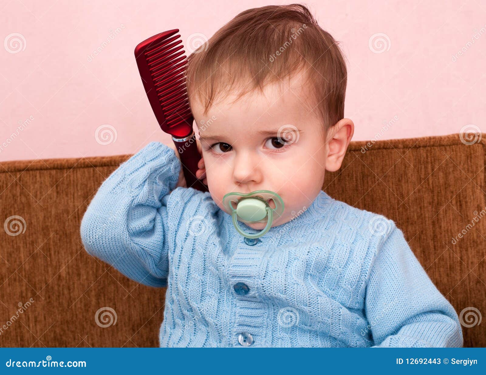 Toddler with a corb stock image. Image of interest, alone - 12692443