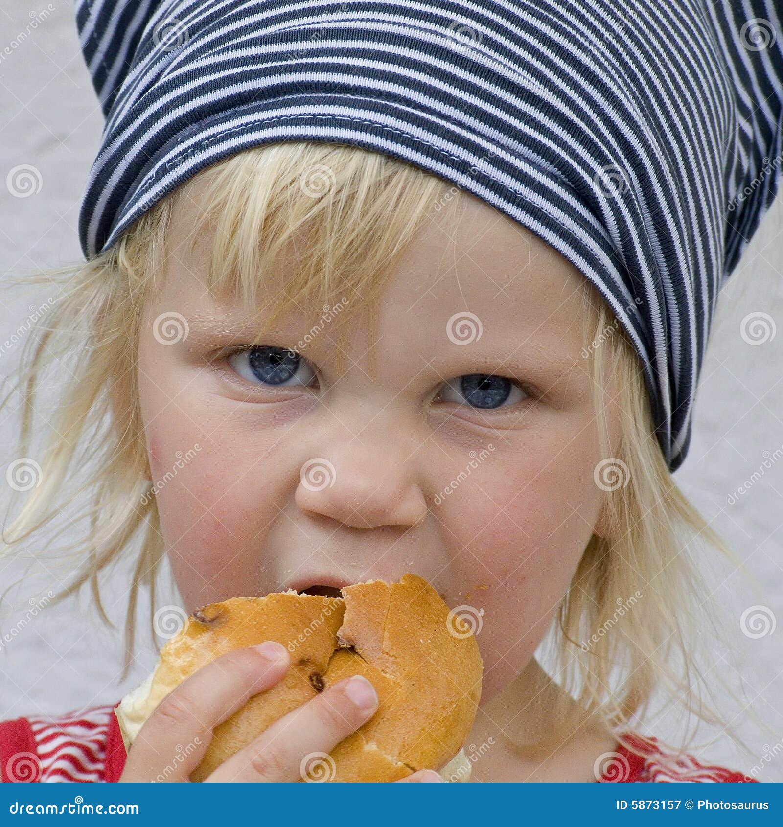 Toddler eating bread roll stock image. Image of charming - 5873157