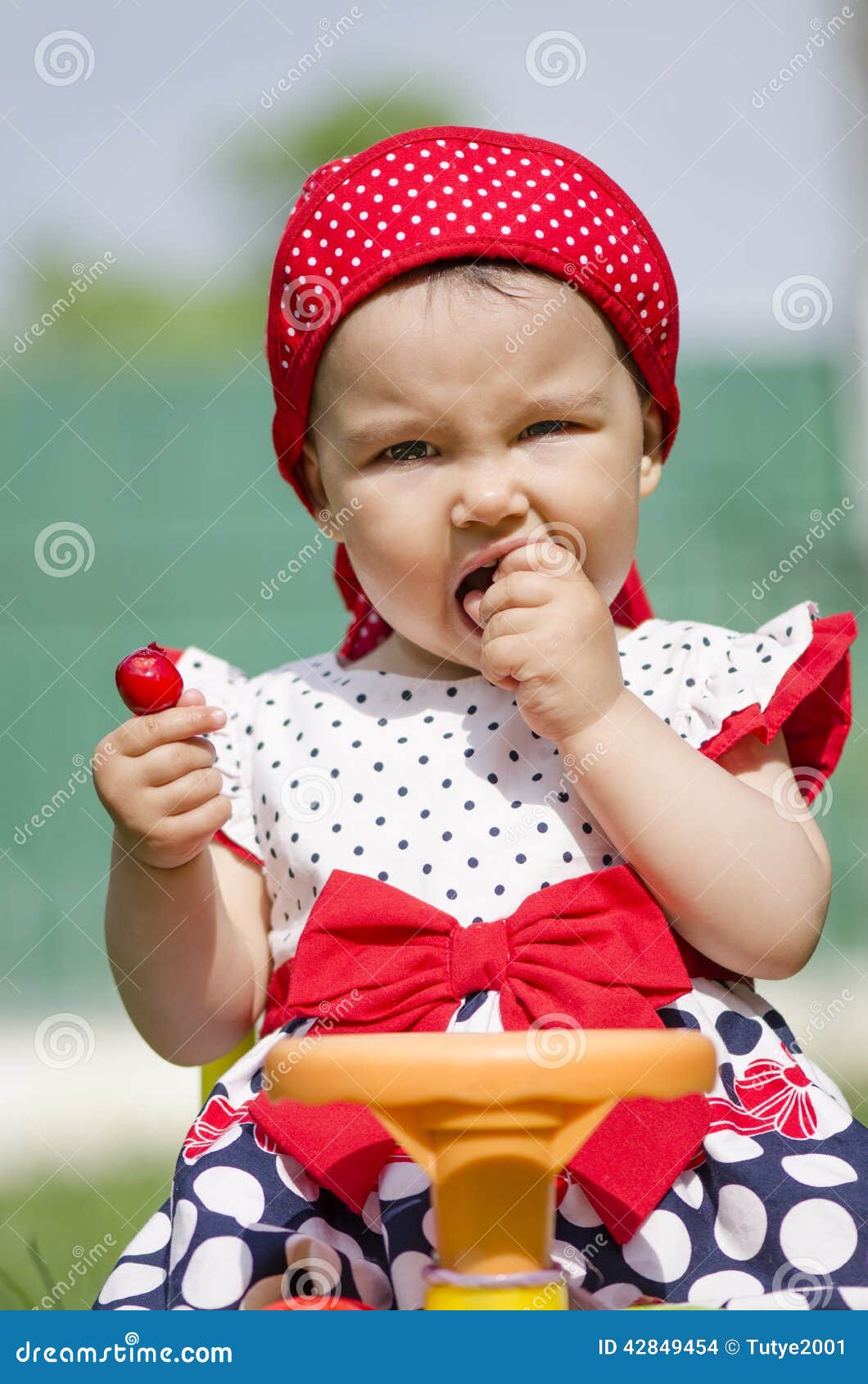 Toddler eating a cherry stock photo. Image of fruit, lovely - 42849454