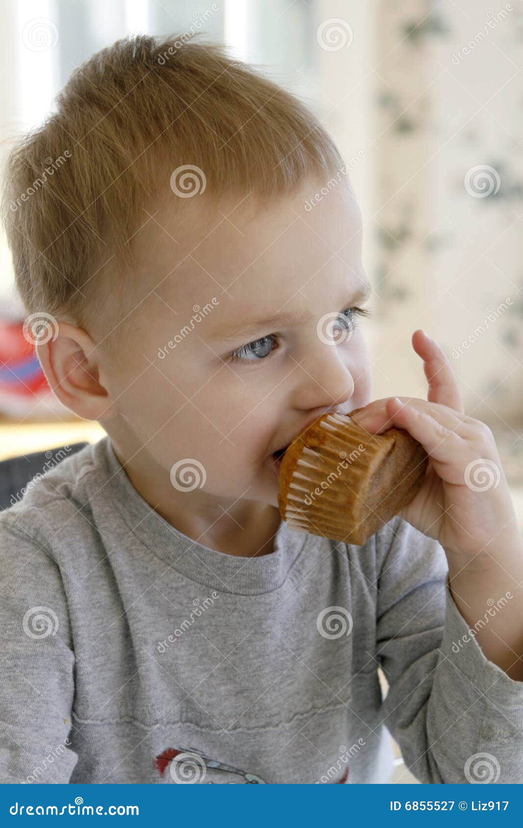 Toddler Eating a Muffin stock image. Image of making, male - 6855527