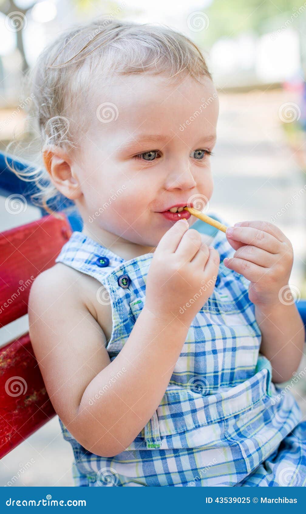 Toddler eating sweet straw stock image. Image of hand - 43539025