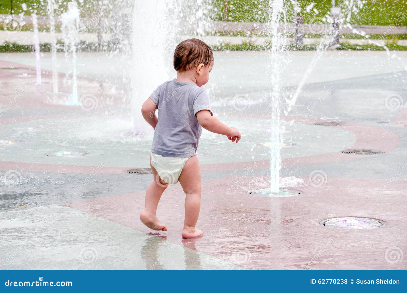 Toddler Exploring Splash Pad Stock Photos - Free & Royalty-Free Stock ...