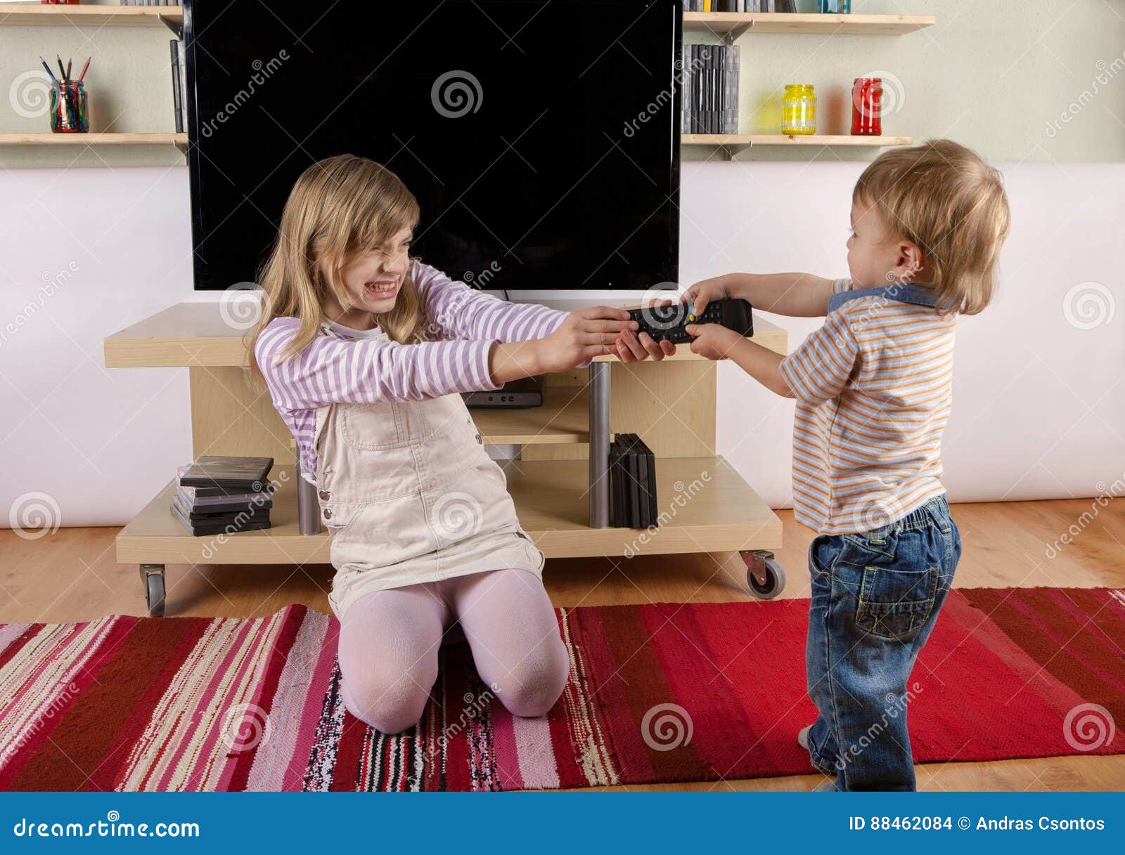 Toddler Fighting with His Sister Over the Remote Control Stock Photo ...