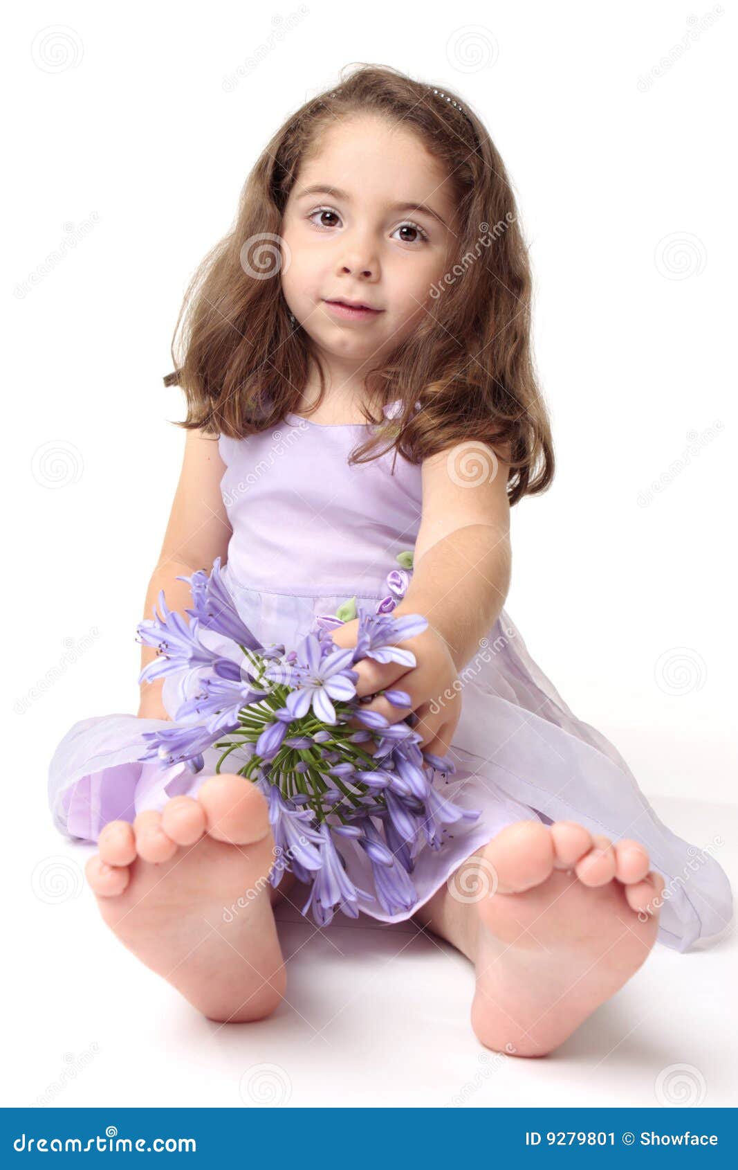 Toddler girl with flowers stock image. Image of girl, sitting - 9279801
