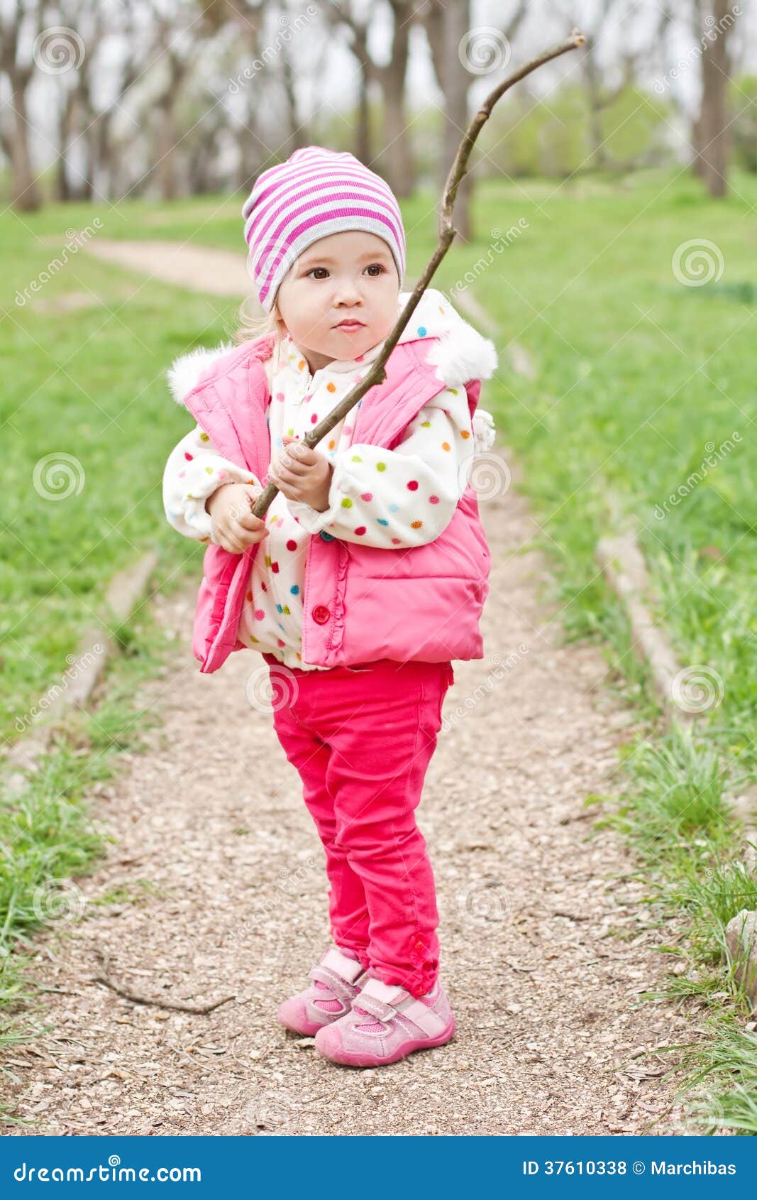 Toddler girl with stick stock photo. Image of little - 37610338
