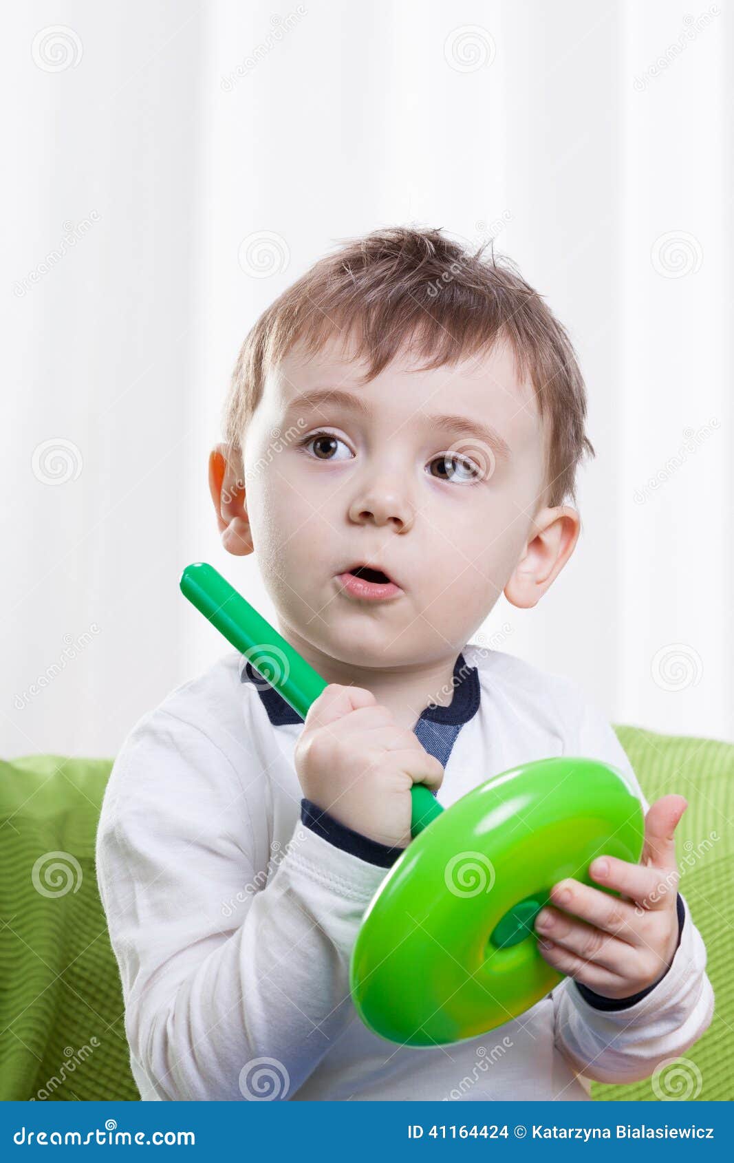 Toddler having fun alone stock photo. Image of indoor - 41164424