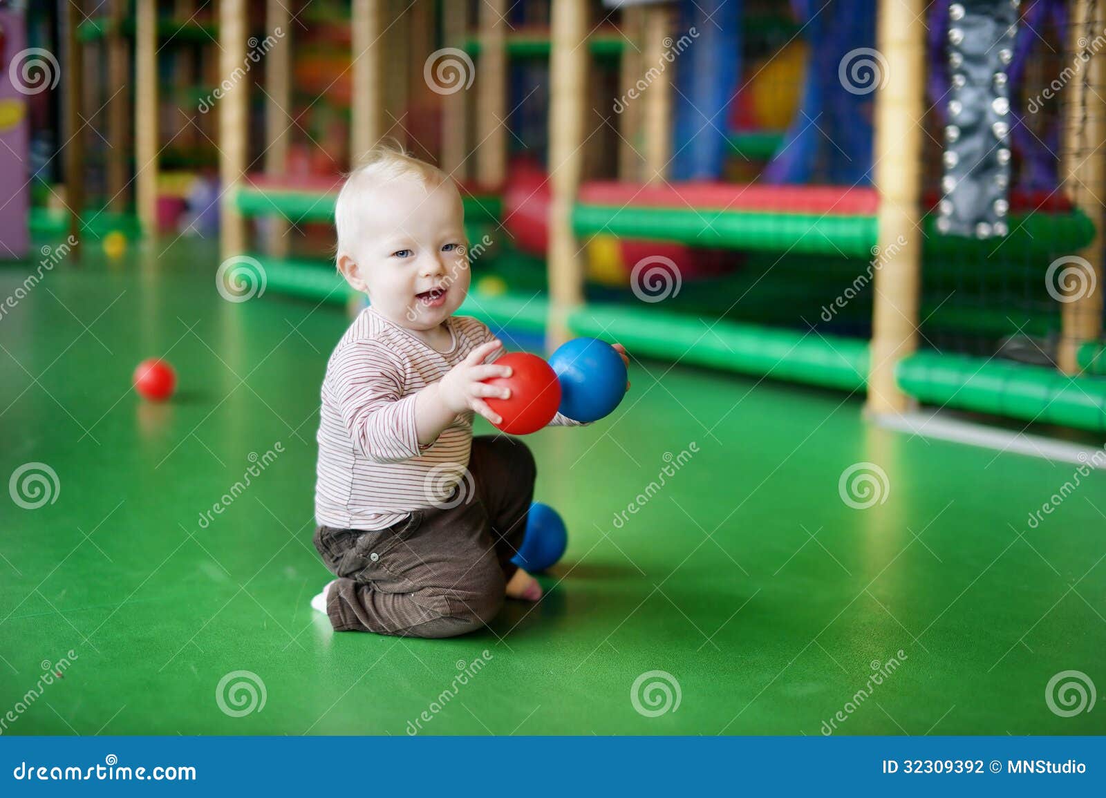 A Toddler Having Fun on a Playground Stock Photo - Image of ...