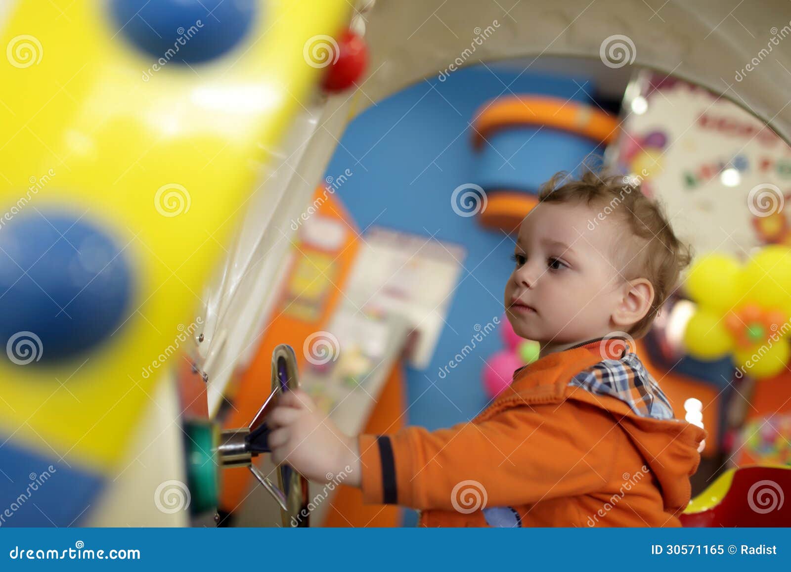 Toddler Playing with Amusement Machine Stock Image - Image of cute ...