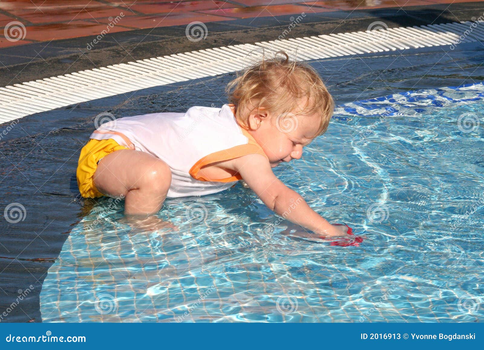 Toddler playing in pool stock image. Image of cute, tiled - 2016913