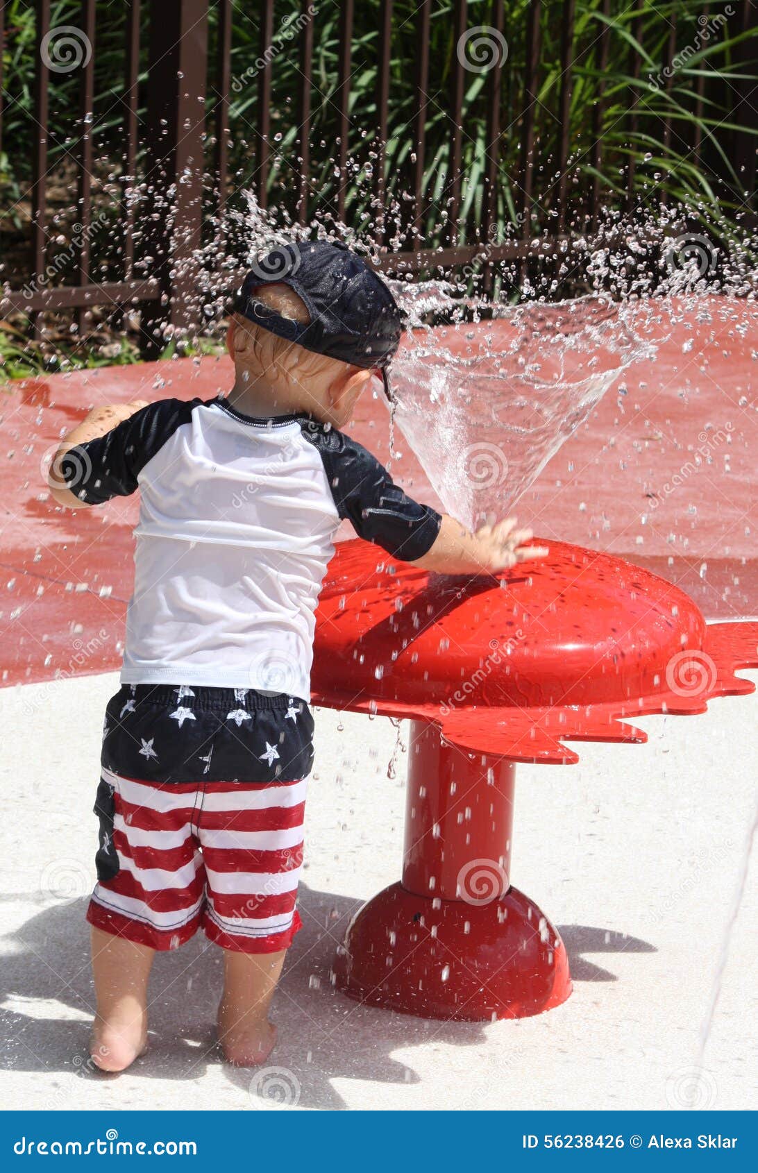 Toddler Playing in Some Water Stock Photo - Image of summer, bathing ...