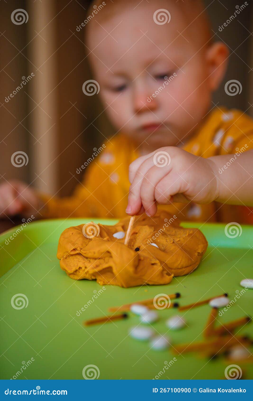 Toddler Plays with Modeling Dough with Small Objects. Stock Photo ...
