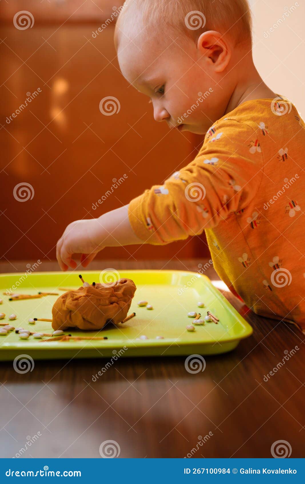 Toddler Plays with Modeling Dough with Small Objects. Stock Photo ...