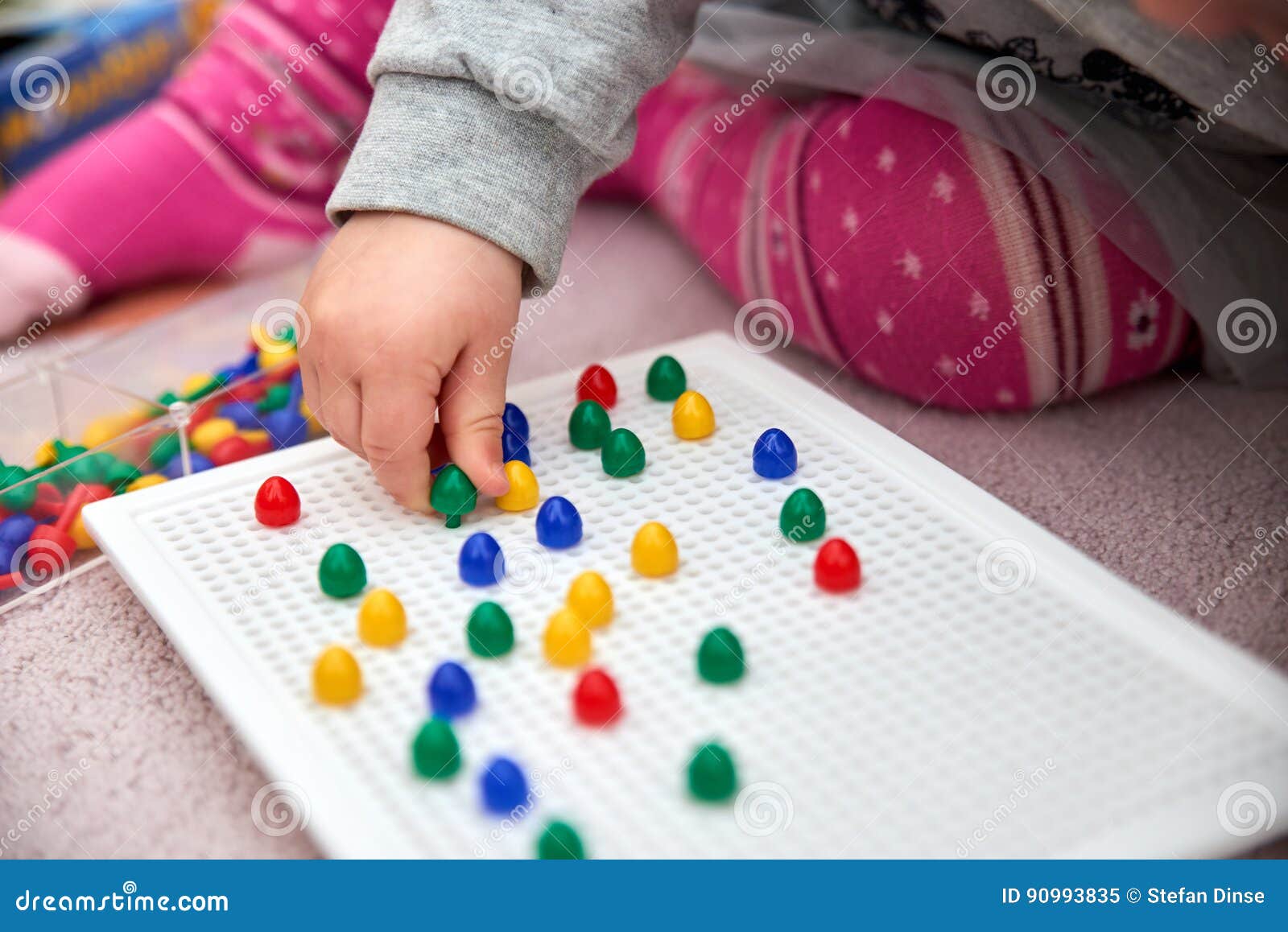 Toddler plays with pins stock image. Image of learn, inside - 90993835