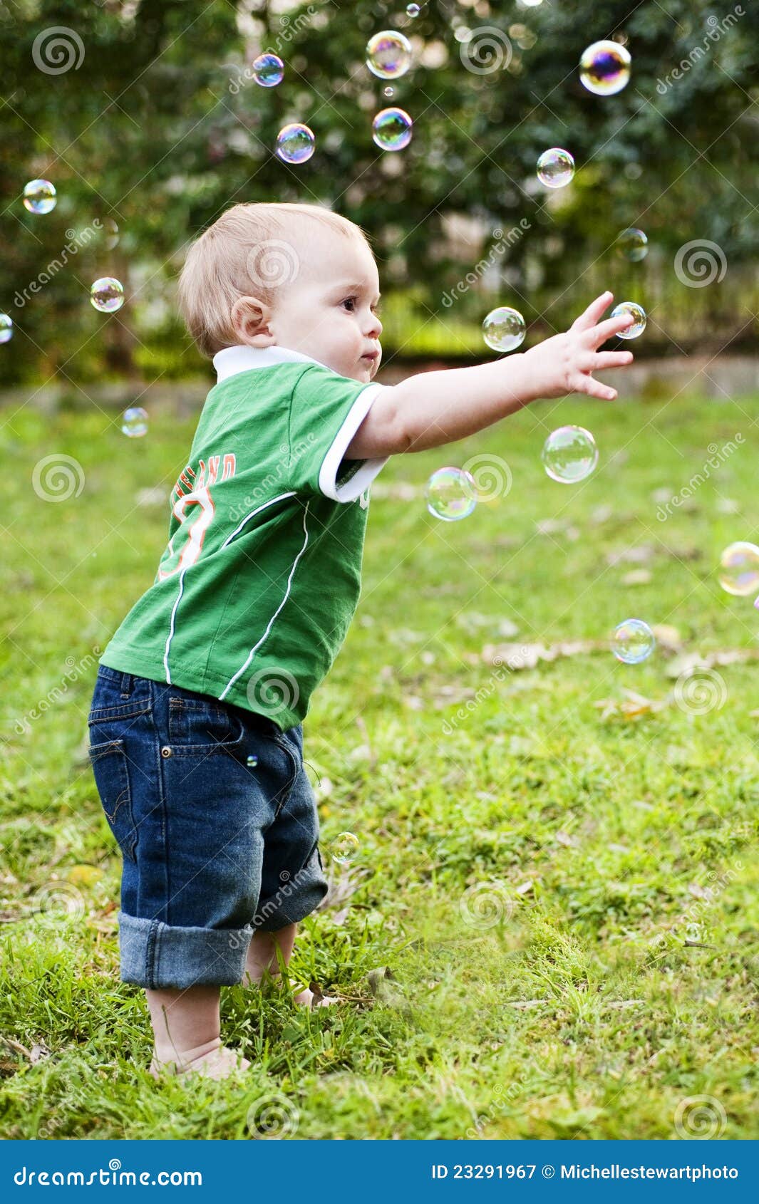 Toddler Reaching for Soap Bubbles Stock Image - Image of touch, soap ...