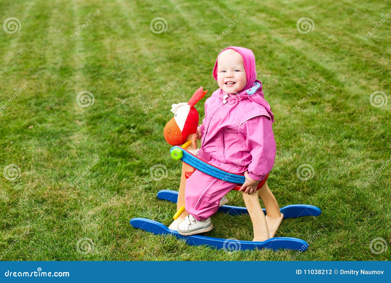 Toddler on rocking horse stock photo. Image of joyful - 11038212