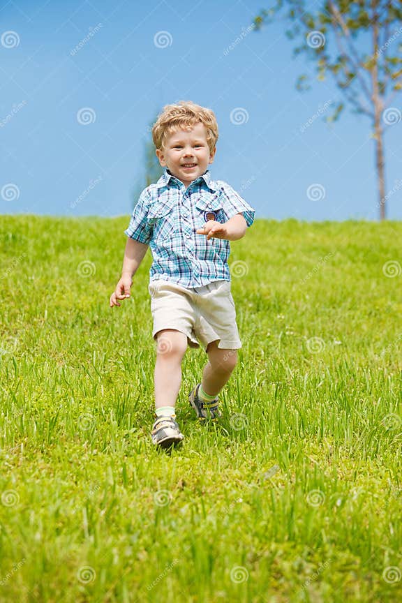 Toddler running stock photo. Image of green, blond, person - 20030788