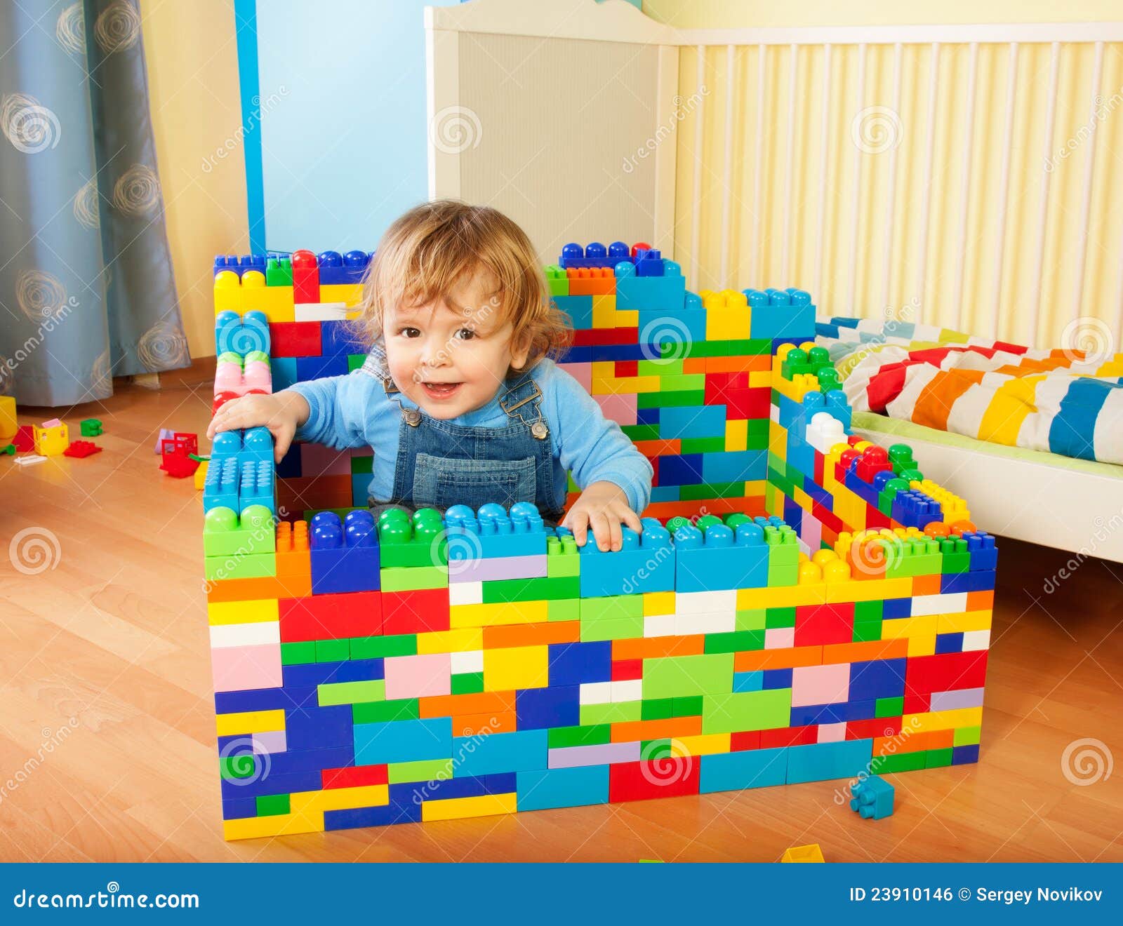 Toddler Sitting a Castle of Toy Blocks Stock Photo - Image of ...