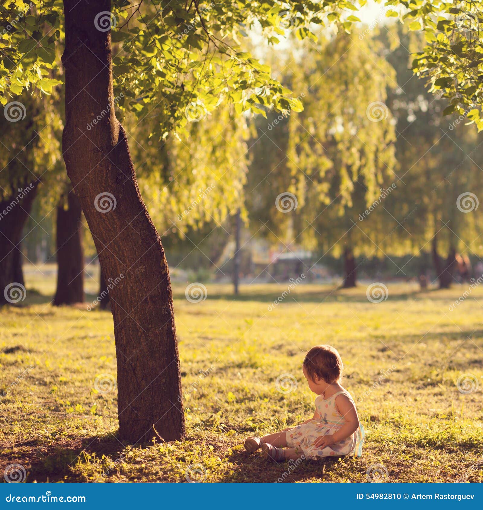 Toddler Sitting Under the Tree Stock Photo - Image of garden, girl ...