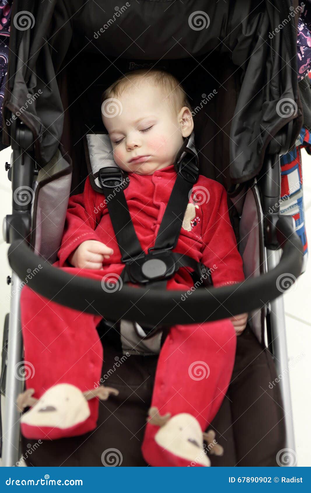 Toddler Sleeping in Stroller Stock Photo - Image of brown, lying: 67890902