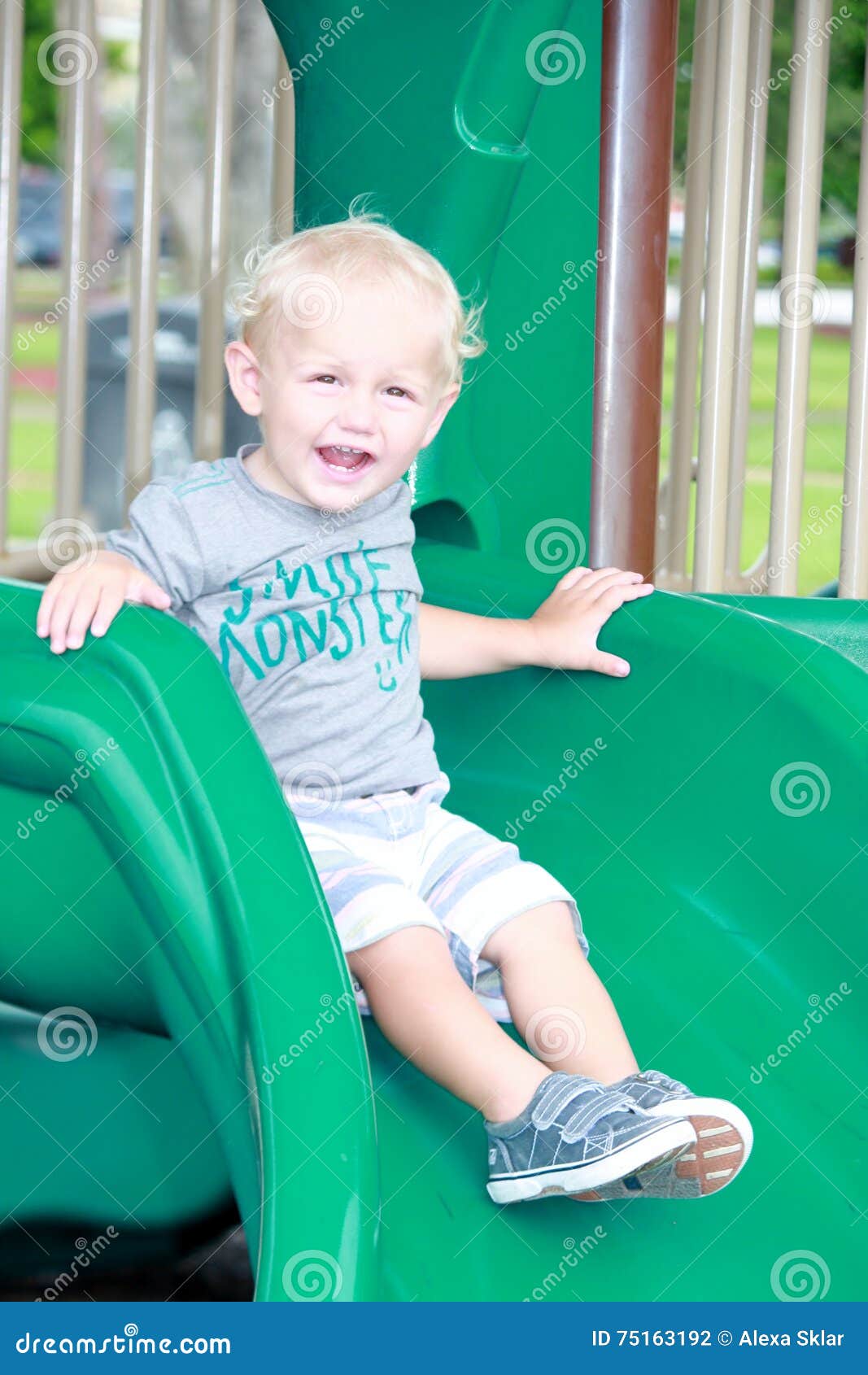 Toddler on slide stock photo. Image of cute, fashion - 75163192
