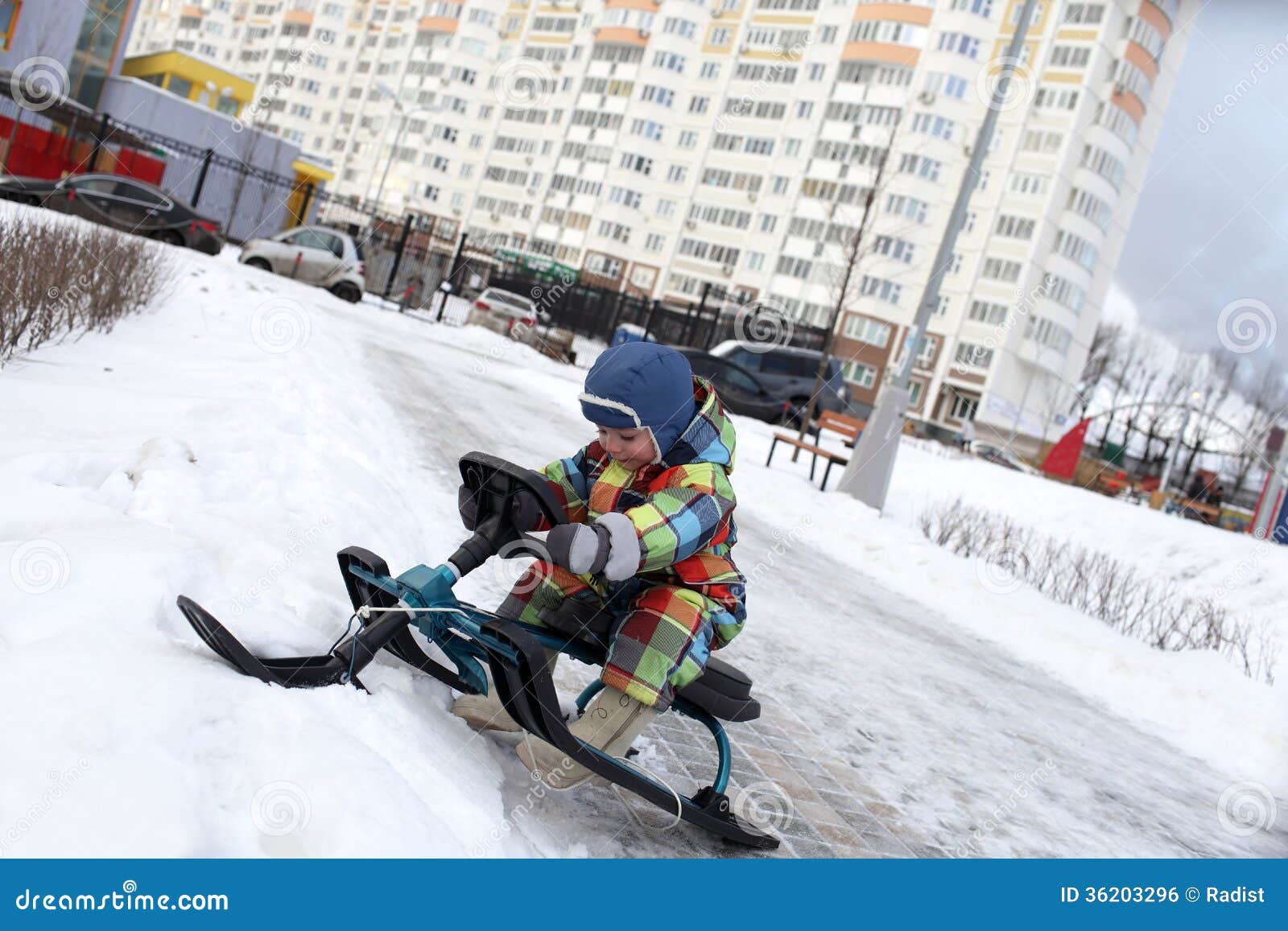 Toddler on a snow scooter stock photo. Image of lifestyle - 36203296