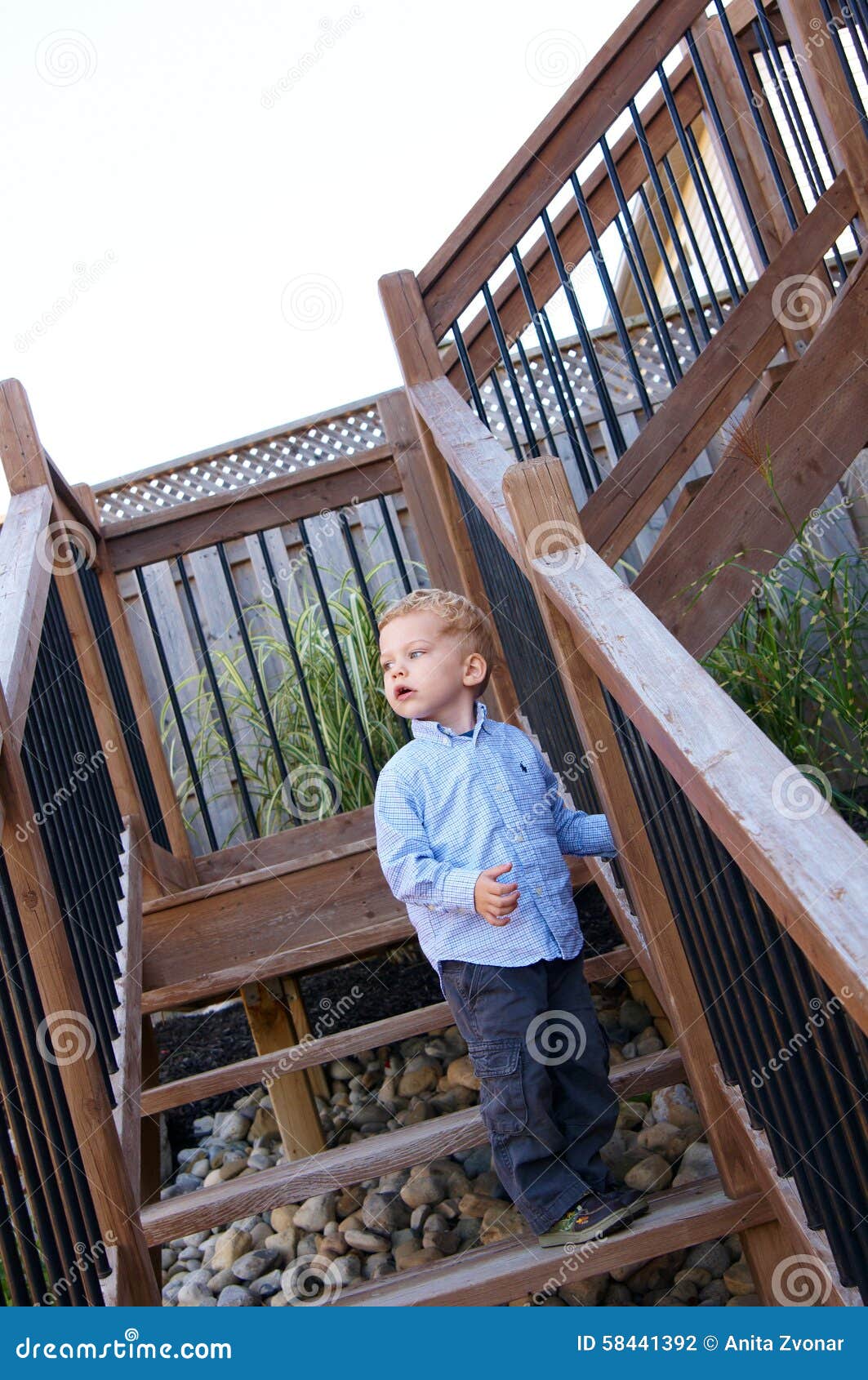 Toddler on steps stock photo. Image of steps, looking - 58441392