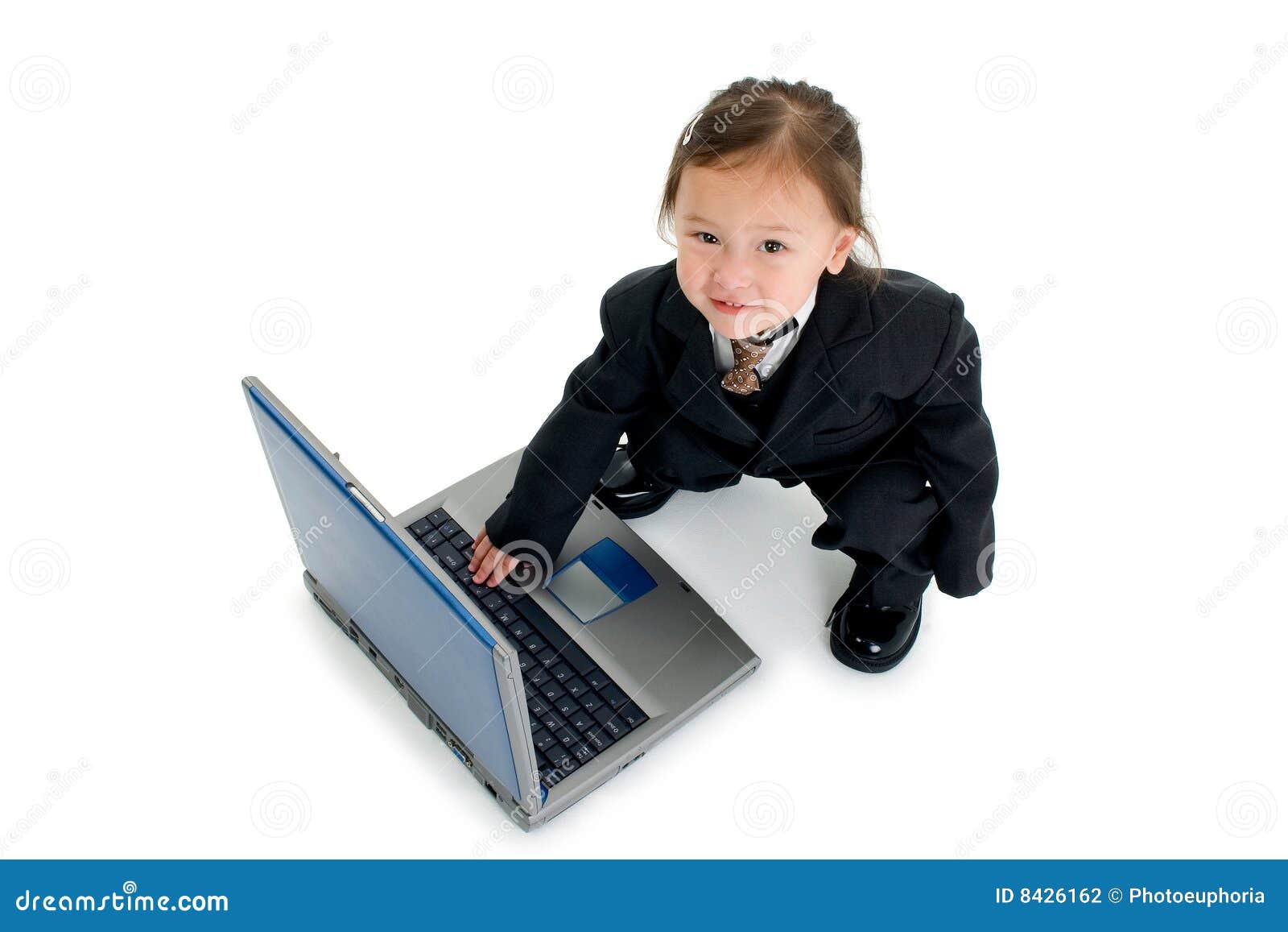 Toddler typing on laptop stock photo. Image of cute, brunette - 8426162