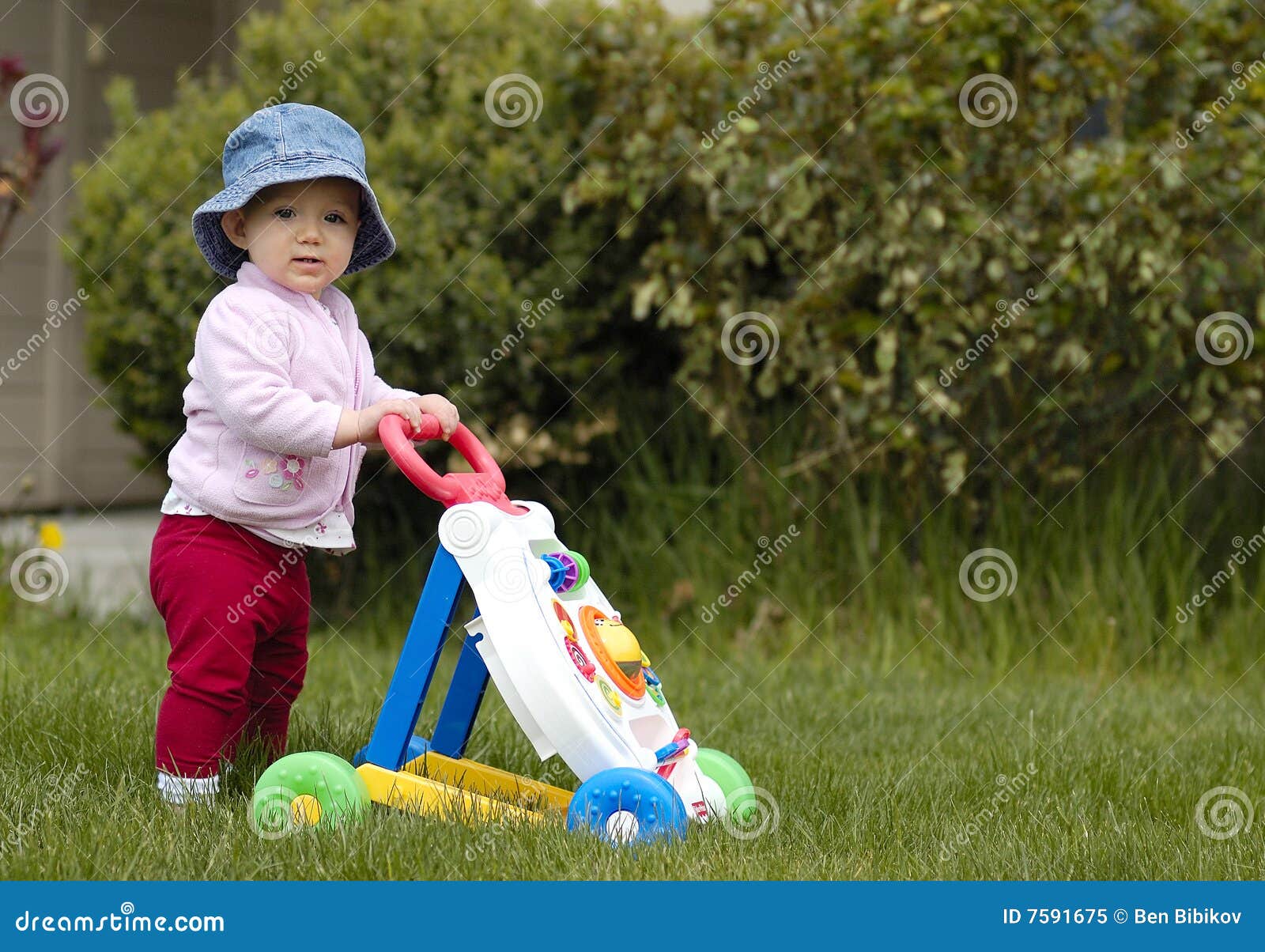 Toddler with walker toy stock image. Image of garden, kiddie - 7591675