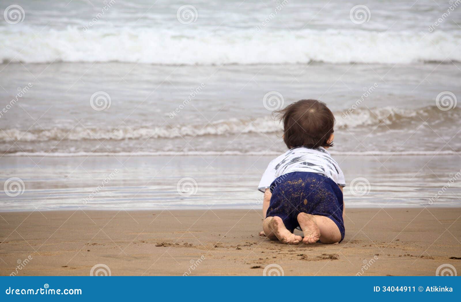 Toddler watching the ocean stock image. Image of toddler - 34044911