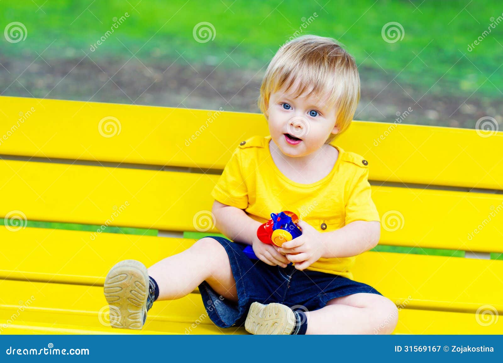Toddler on the Yellow Bench Stock Image - Image of playground, yellow ...