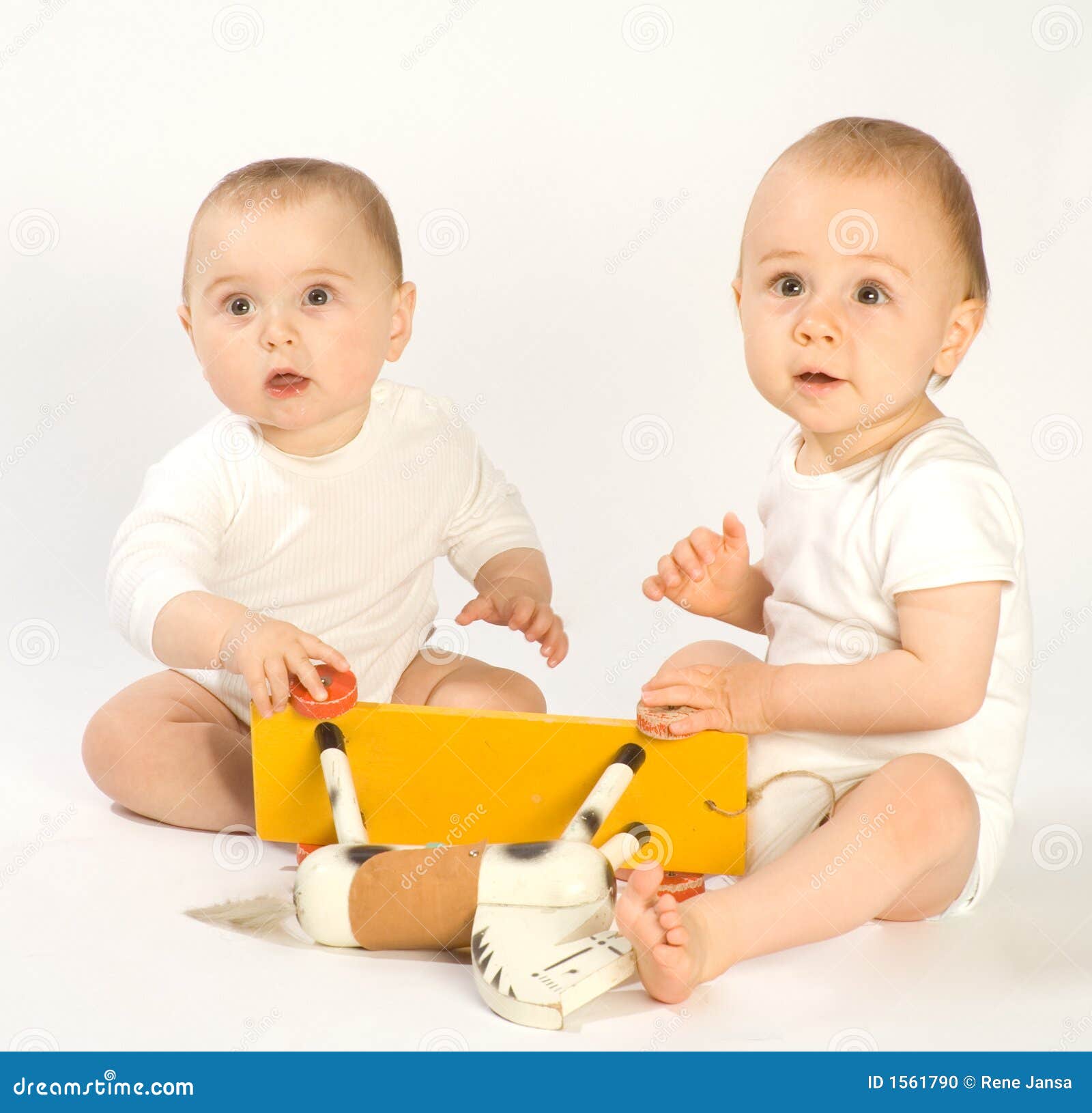 Toddlers and rocking horse stock photo. Image of inquisitive - 1561790
