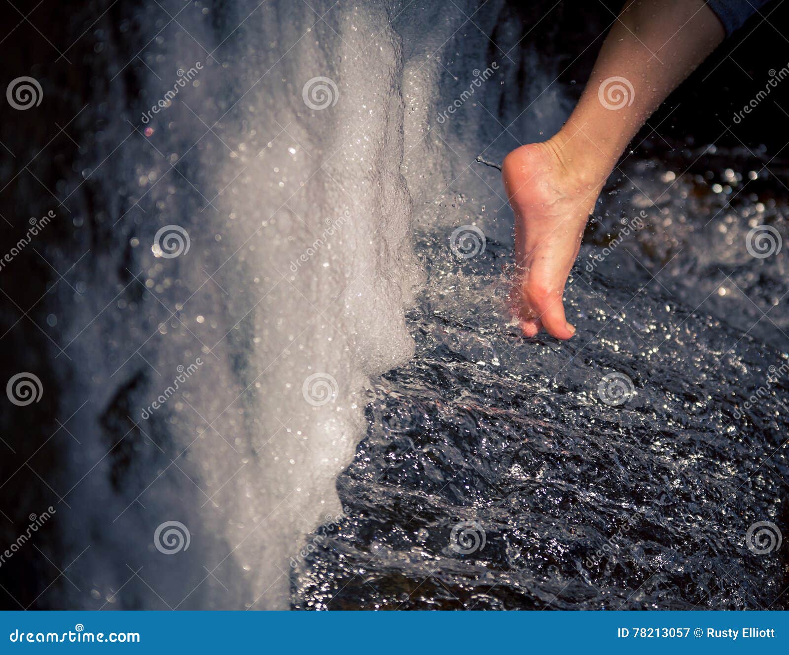 Toe in a cold waterfall stock image. Image of refreshing - 78213057