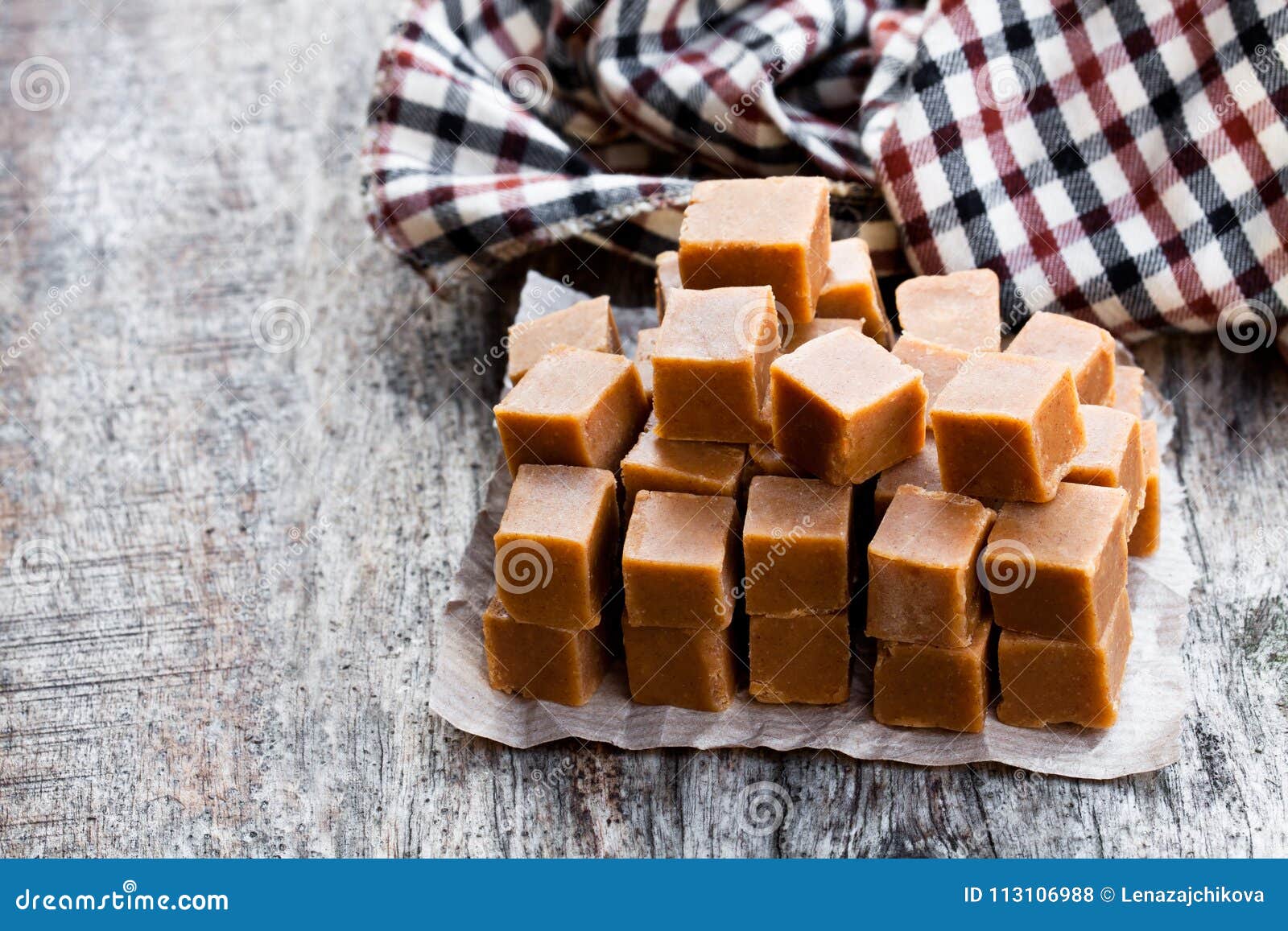 Toffee Cubes on Wooden Table Stock Photo - Image of cooking, powder ...