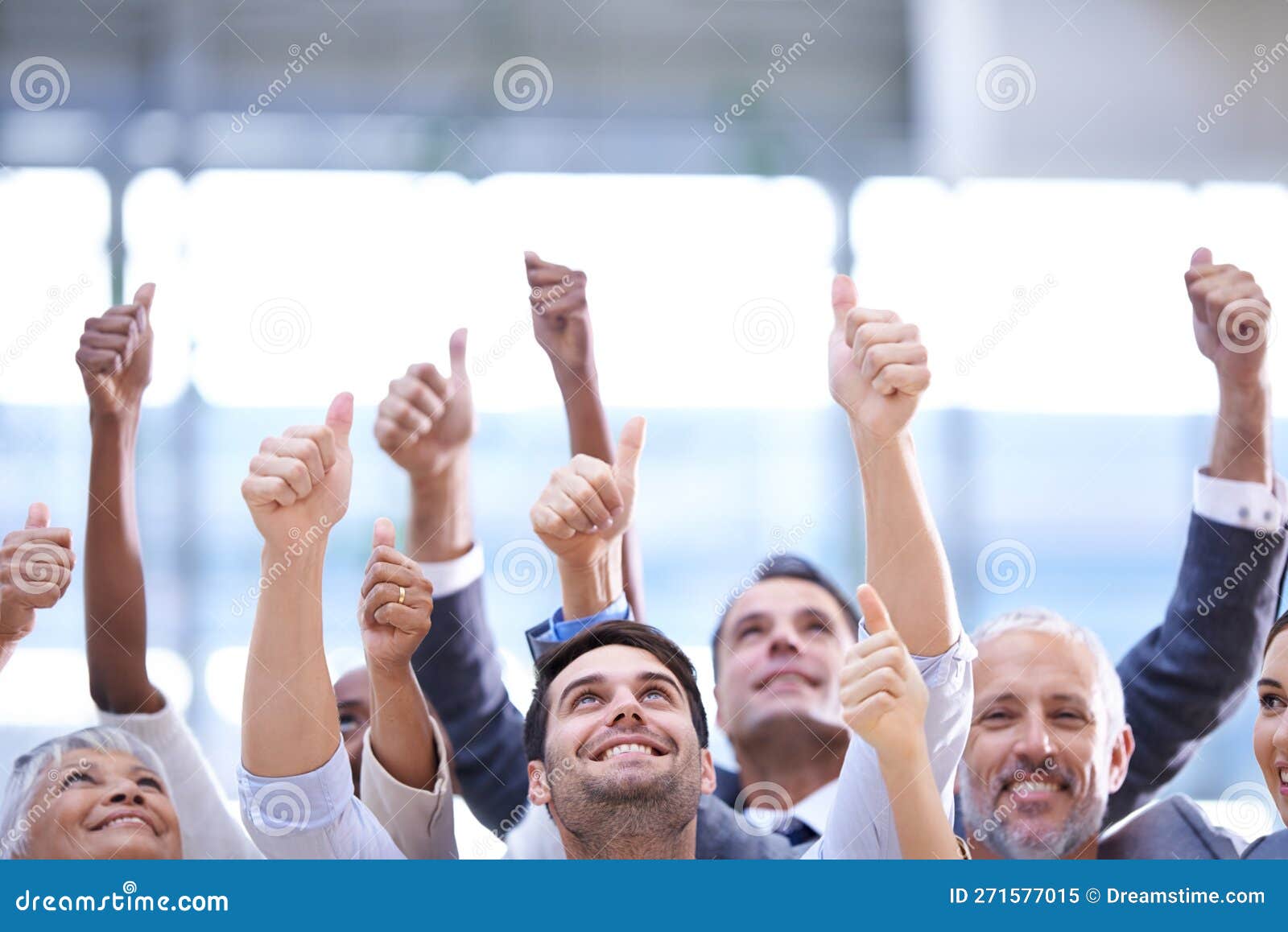 Together we Can Do it All. a Group of Office Workers Giving the Thumbs ...