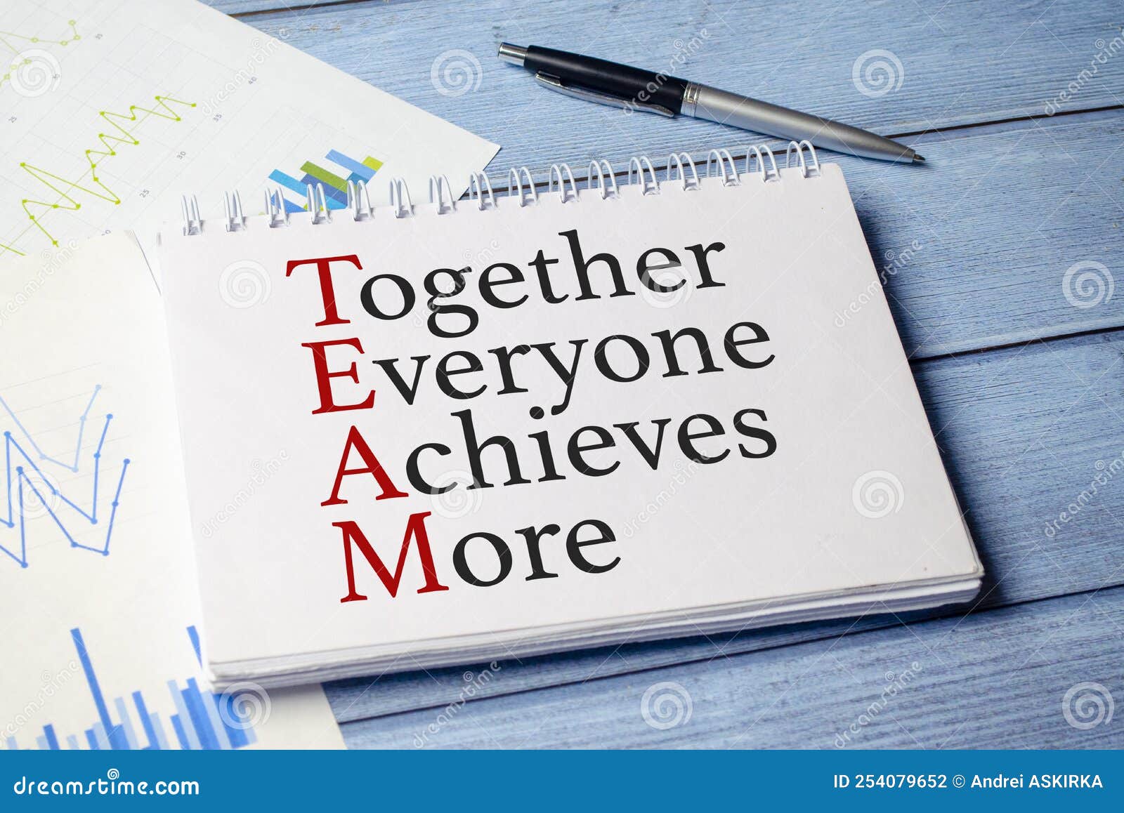 Together Everyone Achieves More Words with Charts and Pen Stock Photo ...