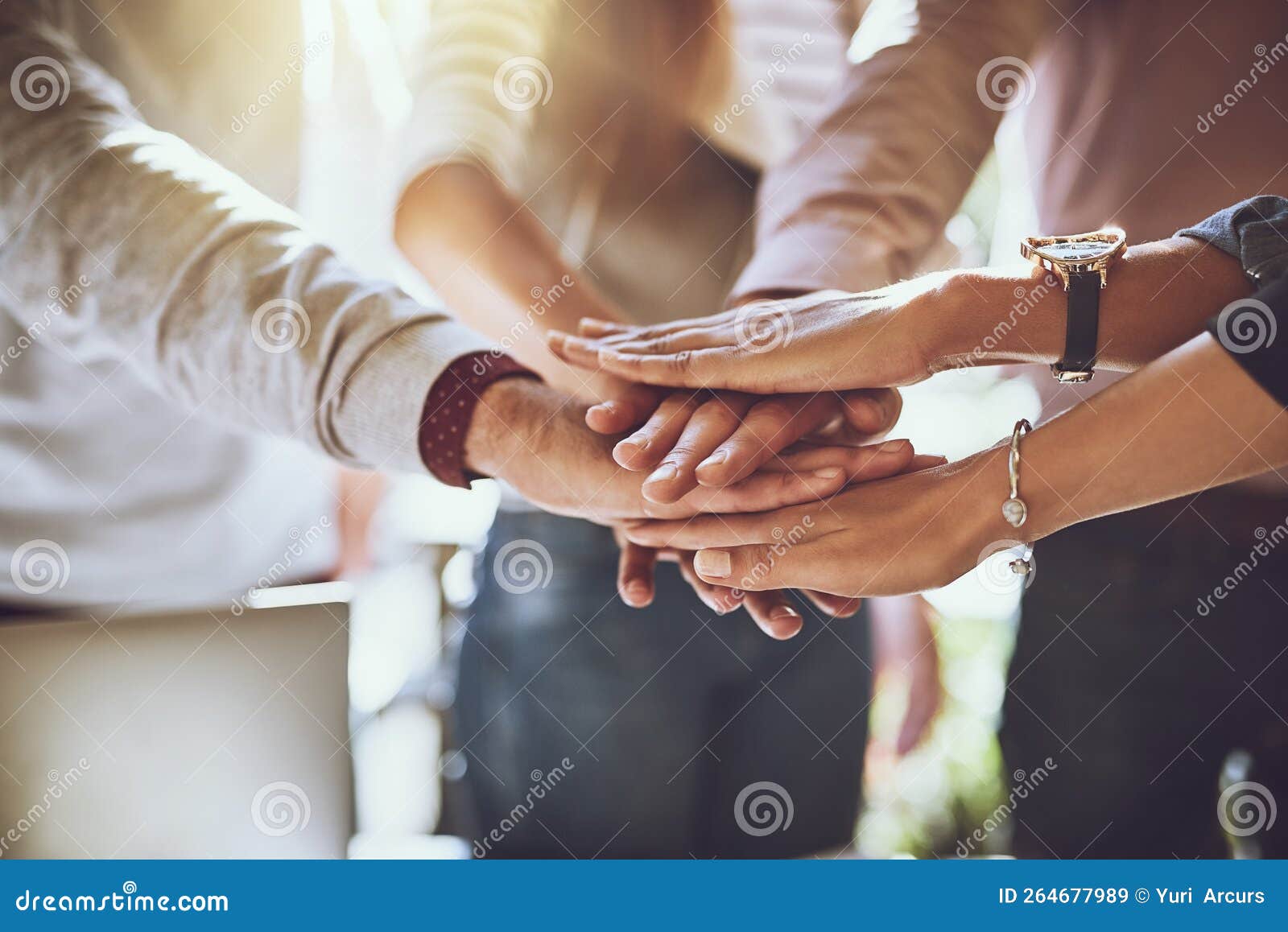 Together we Make a Team. a Group of Colleagues Joining Hands in ...