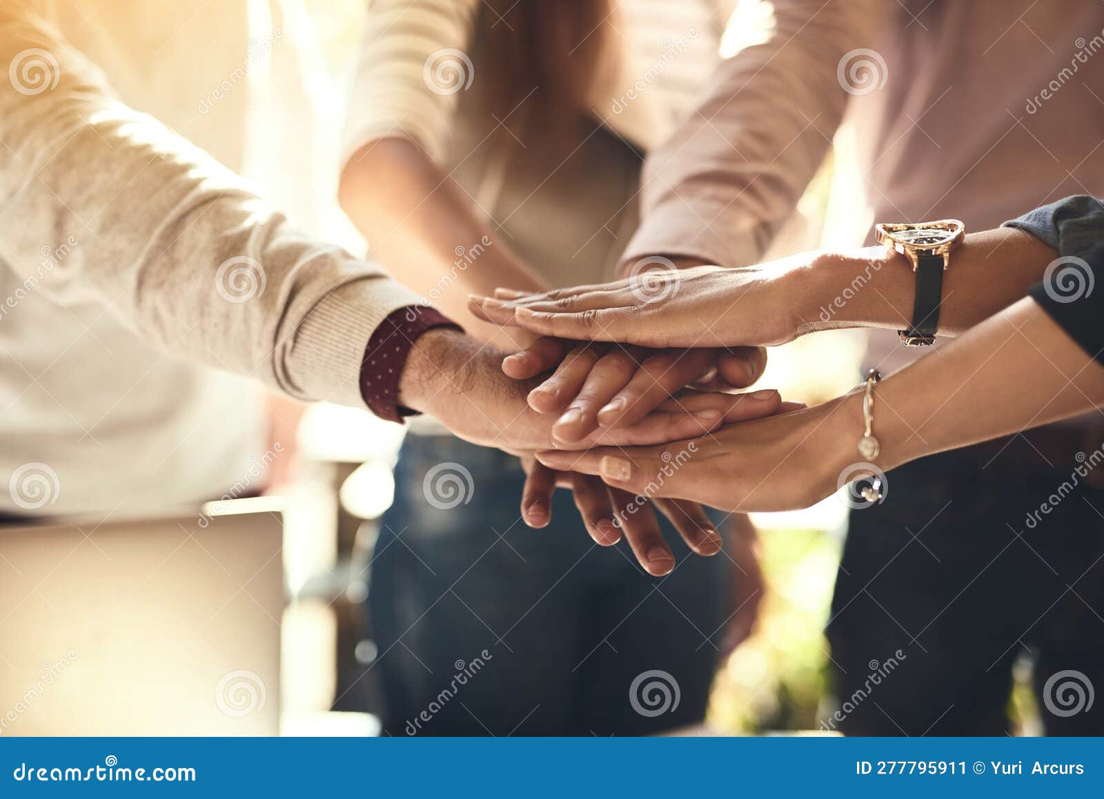 Together we Make a Team. a Group of Colleagues Joining Hands in ...