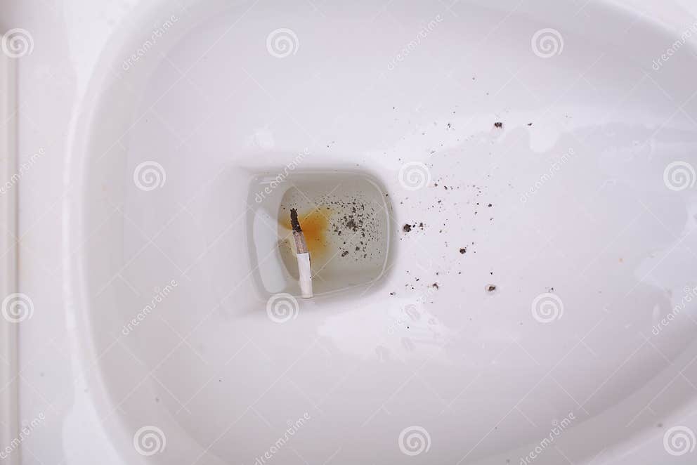 Toilet Bowl with Extinguished Cigarette Stock Image - Image of lavatory ...