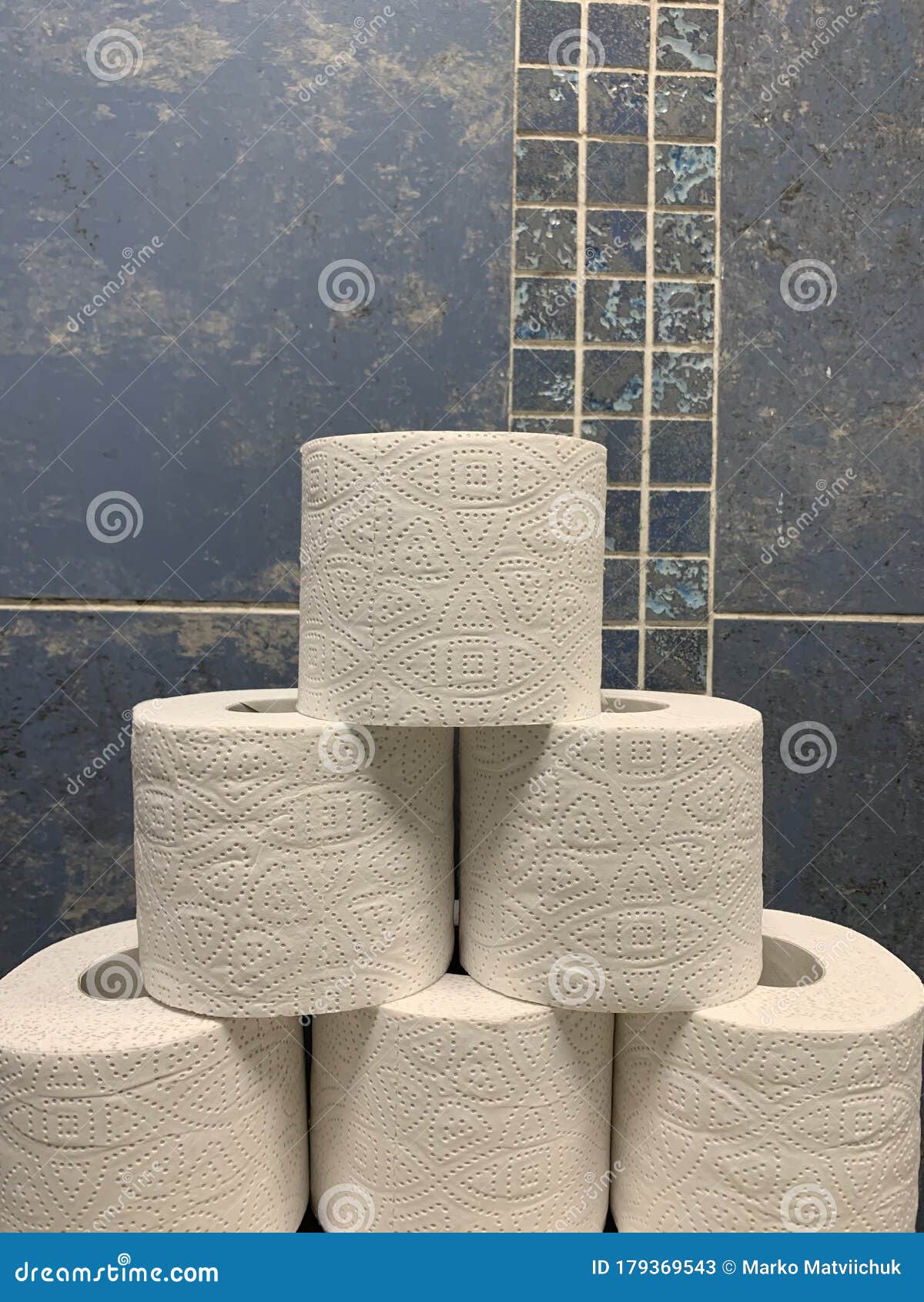 Toilet Paper Pyramid with Blue Background Behind Stock Image - Image of ...