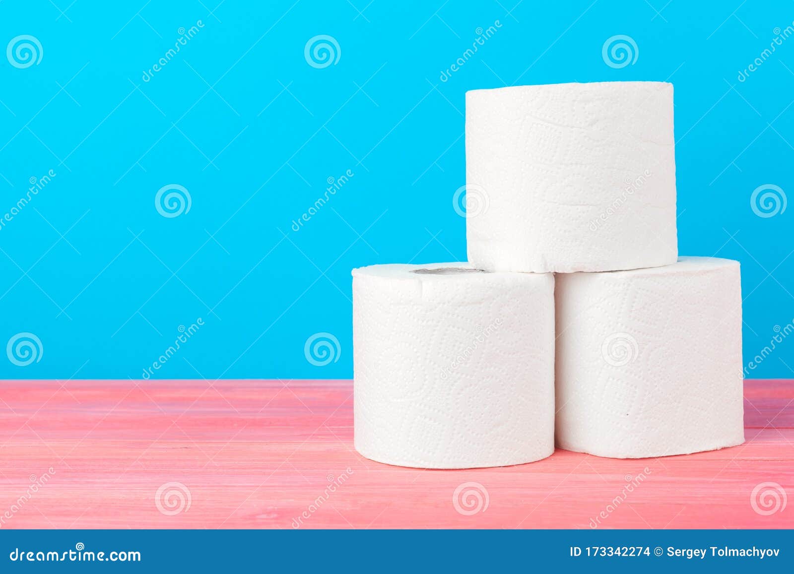 Toilet Paper Stack on Bright Blue Background Stock Photo - Image of ...