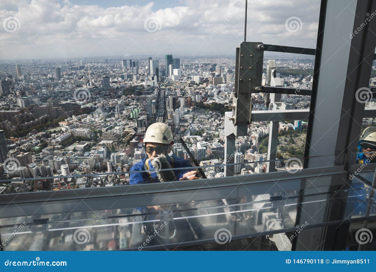 Worker Cleaning the Window of the High Building in Tokyo Japan ...