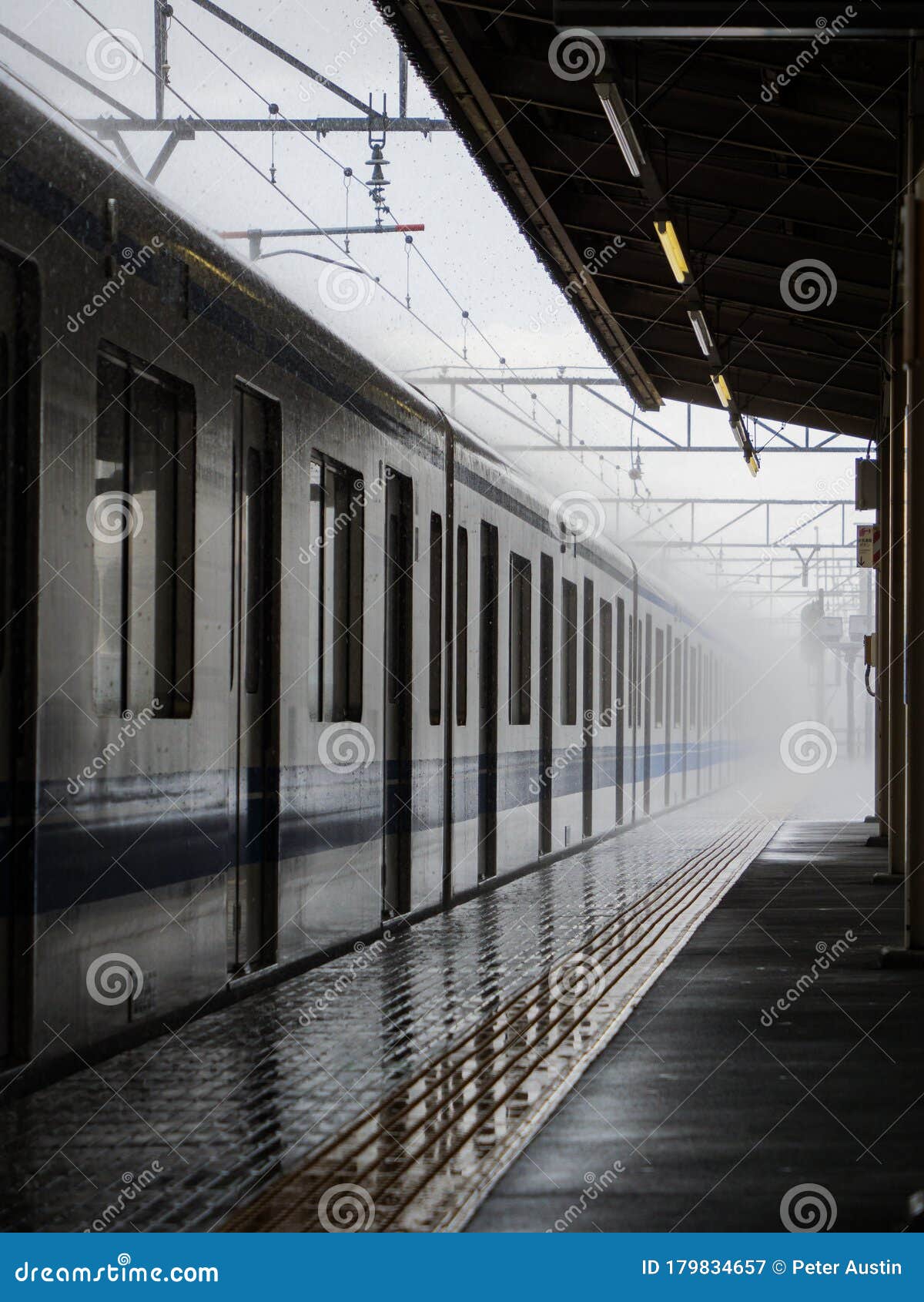 Tokyo, Japan - 27 8 19: a Train Arriving at the Platform in Very Heavy ...