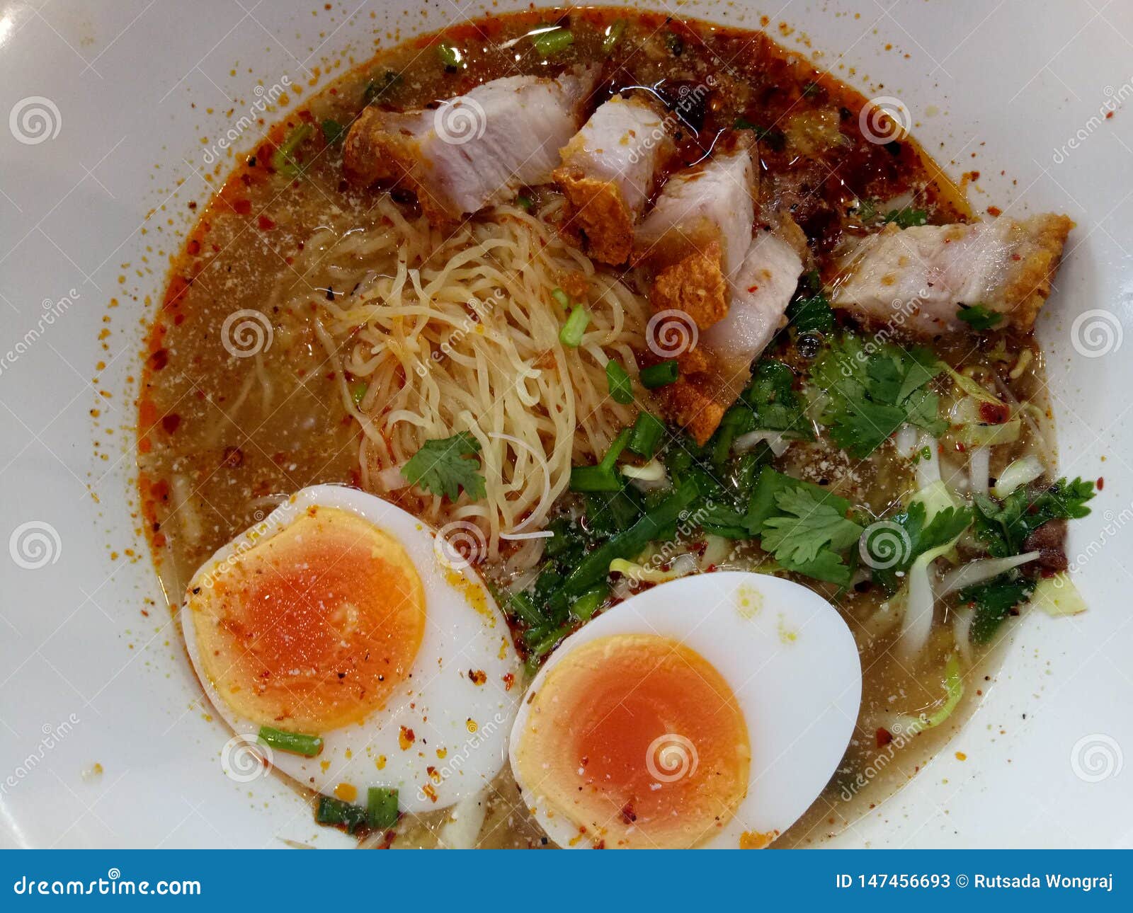 Tom Yum Noodles with Boiled Eggs and Crispy Pork Stock Image - Image of ...