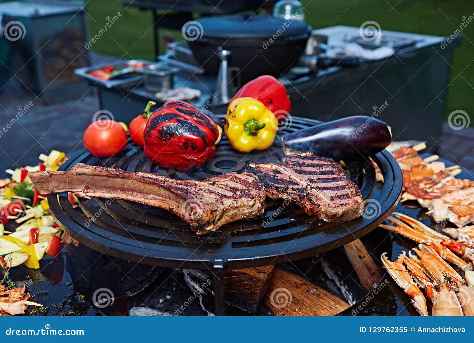 Tomahawk Rib Beef Steak and T-bone on Hot Black Grill. Stock Image ...