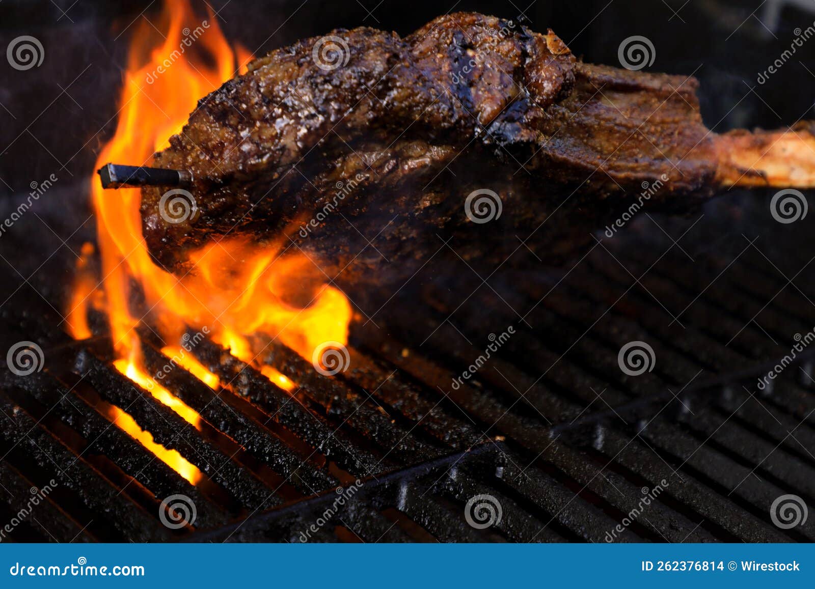 Tomahawk Steak on a Grill Grid on Fire Stock Photo - Image of grilling ...