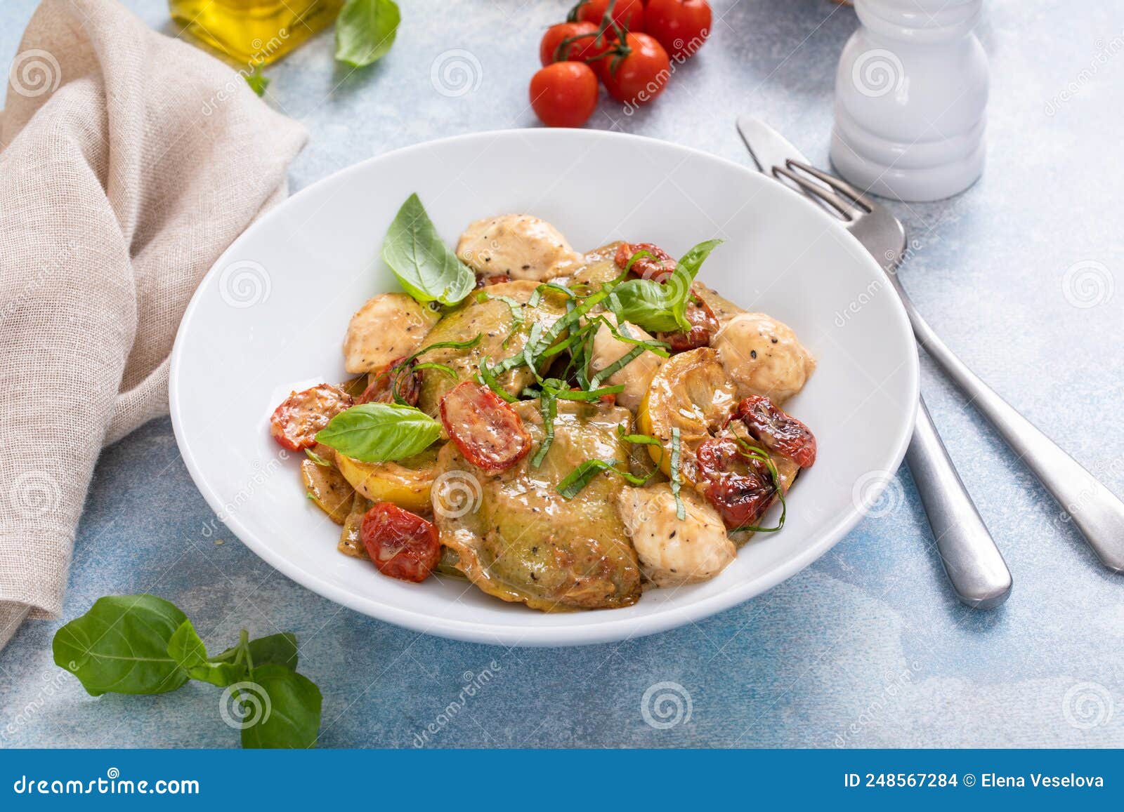 Tomato Basil Ravioli Served with Mozzarella and Basil Stock Photo ...