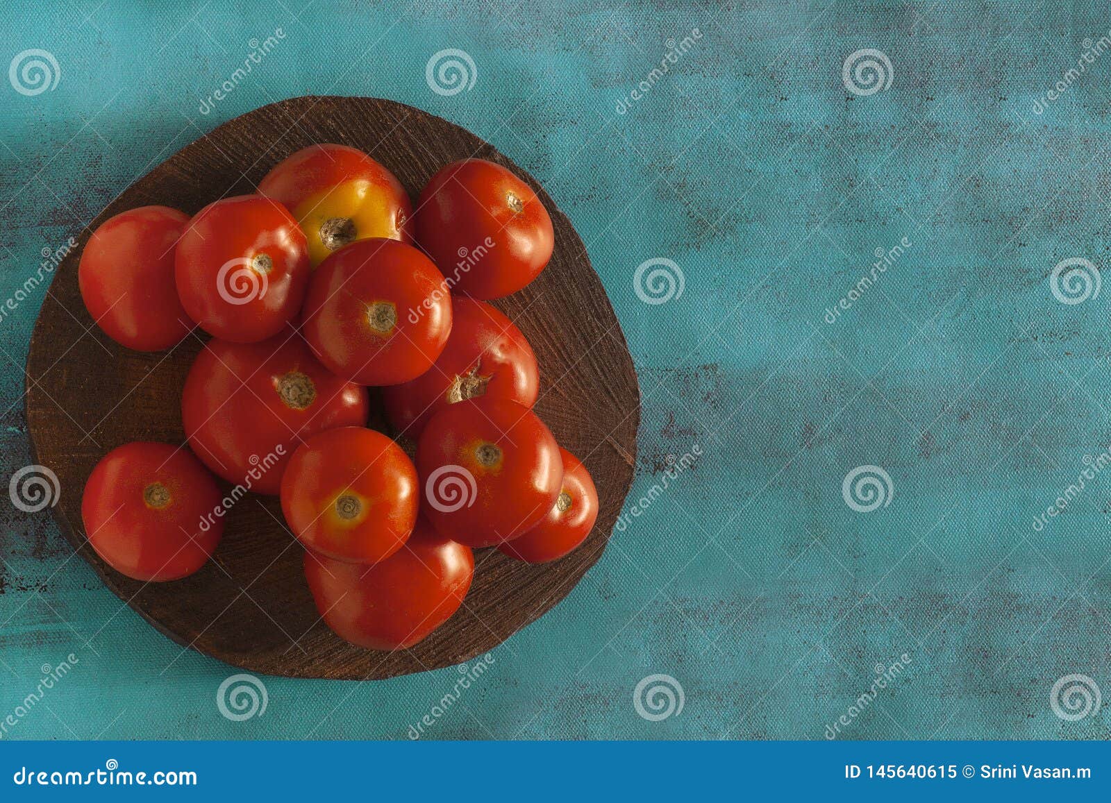 Tomato on circle wood. stock image. Image of tasty, energy - 145640615