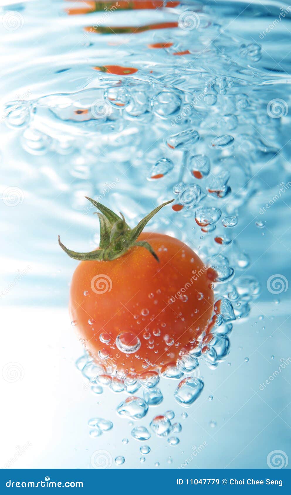 Tomato drop in water stock image. Image of motion, reflection - 11047779