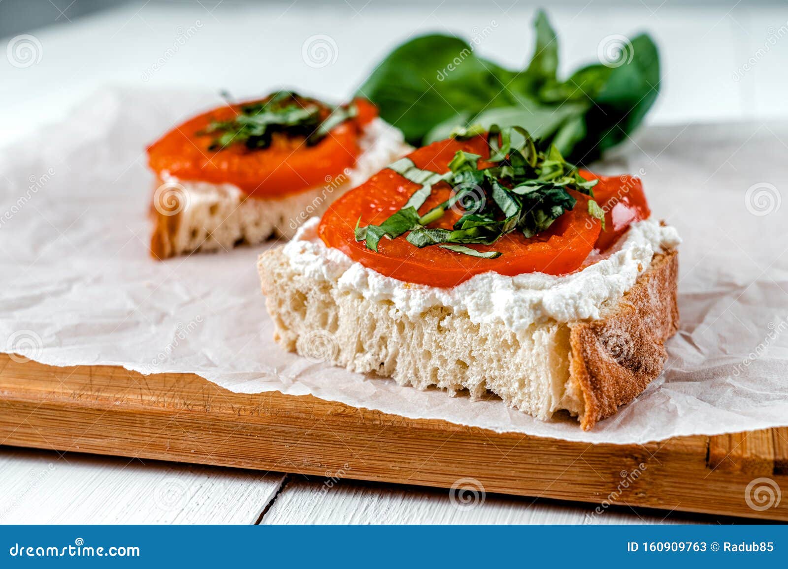 Tomato and Ricotta on Toast with Basil Stock Image - Image of ...