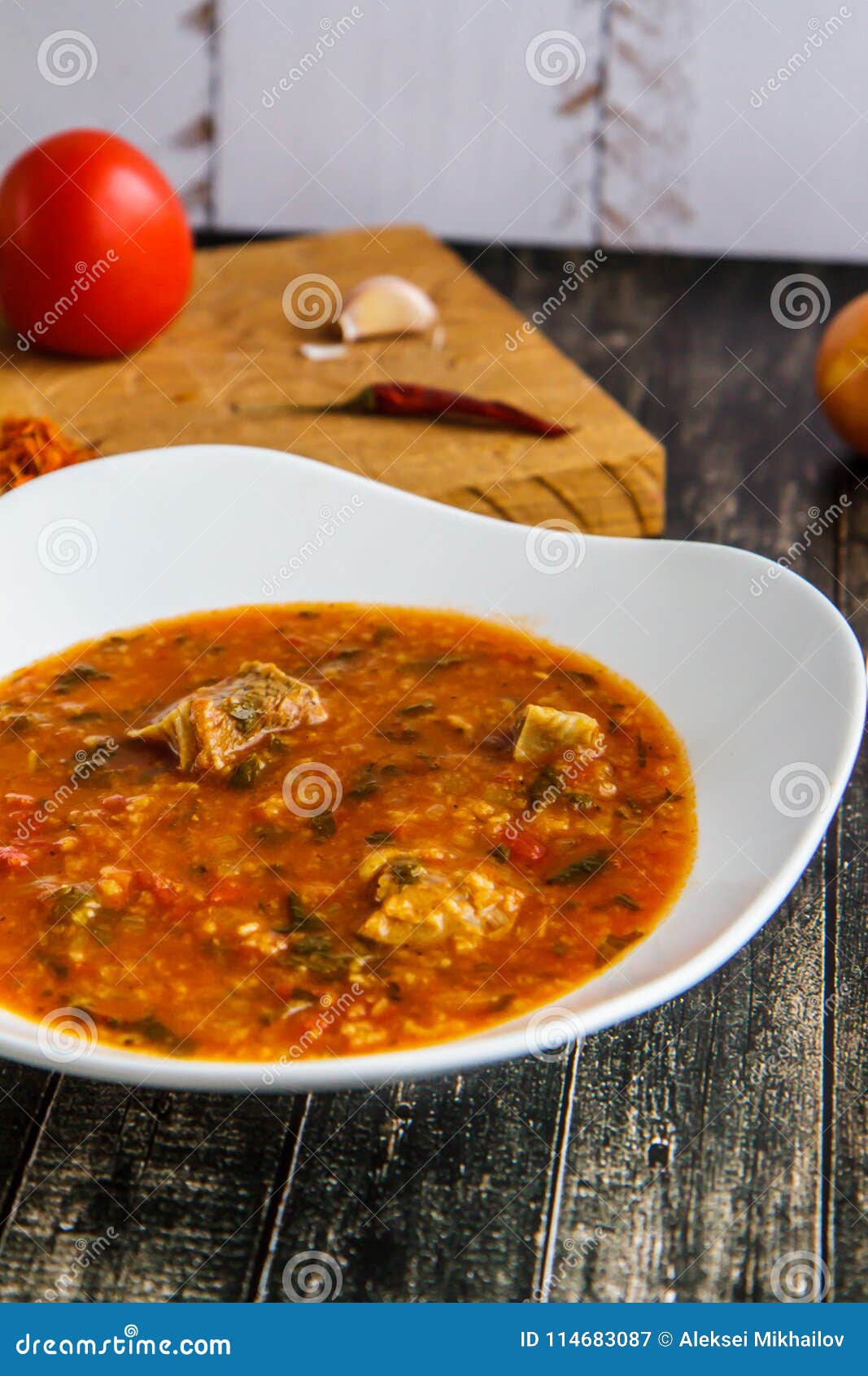 Tomato Soup in a White Plate on Old Boards Side View Stock Image ...
